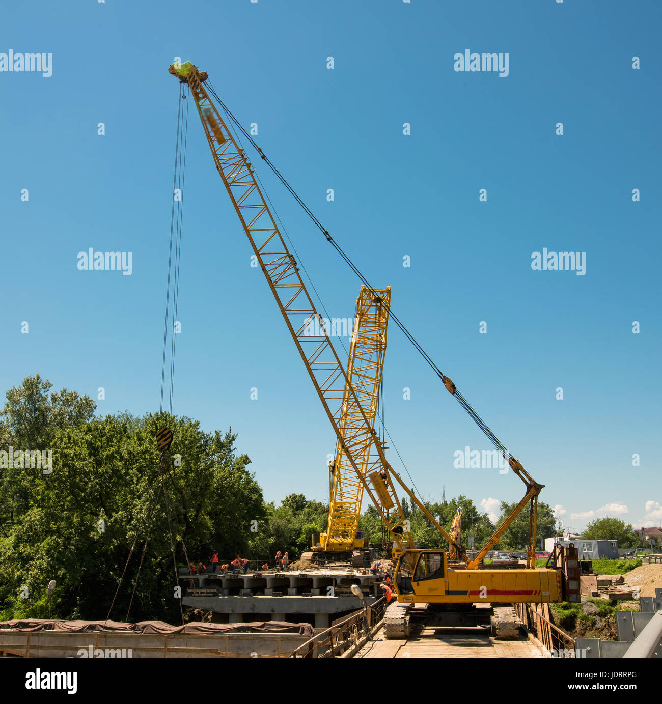 Crane lifting construction material hi-res stock photography and images ...