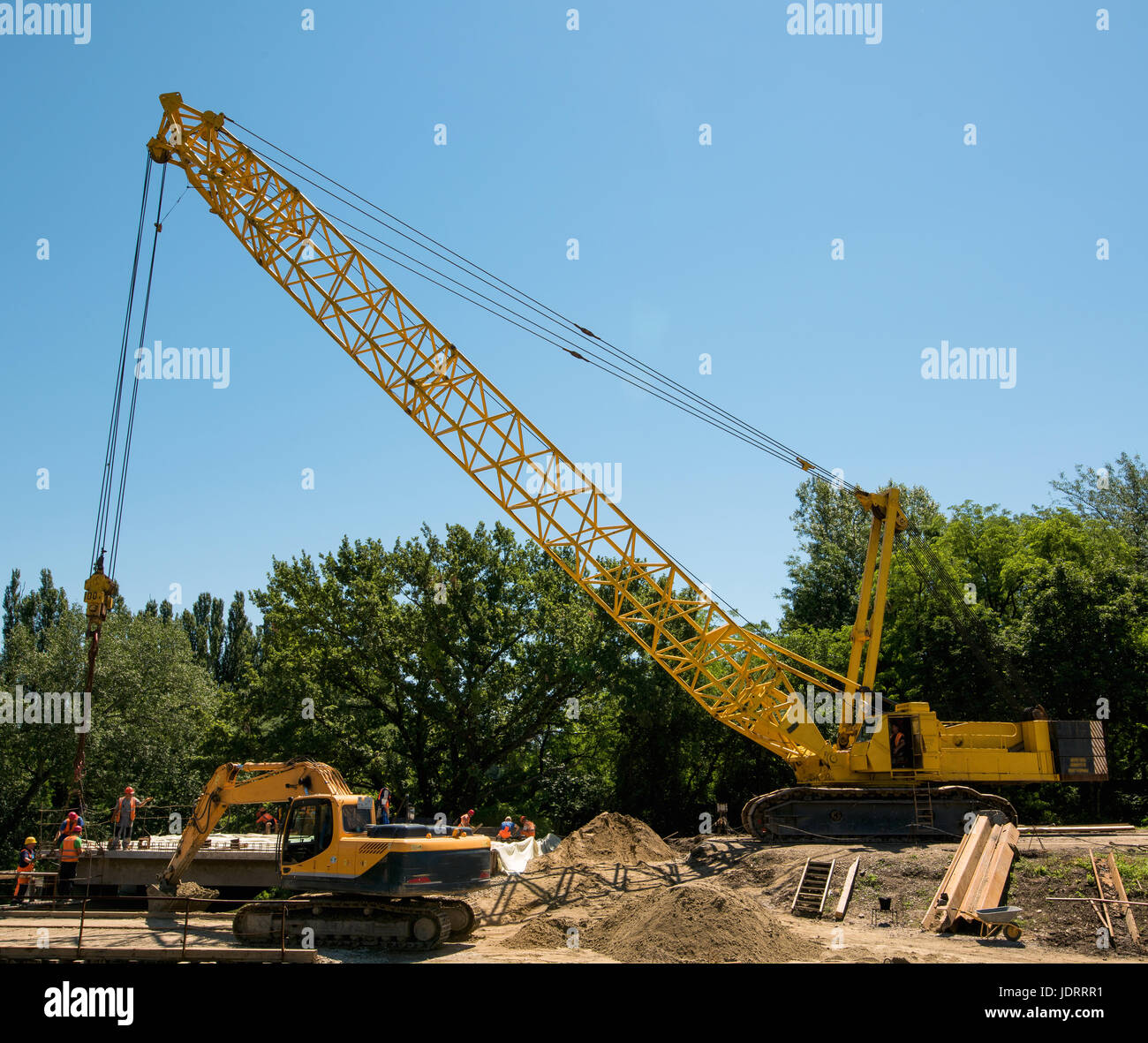 crawler crane on a bridge Stock Photo - Alamy
