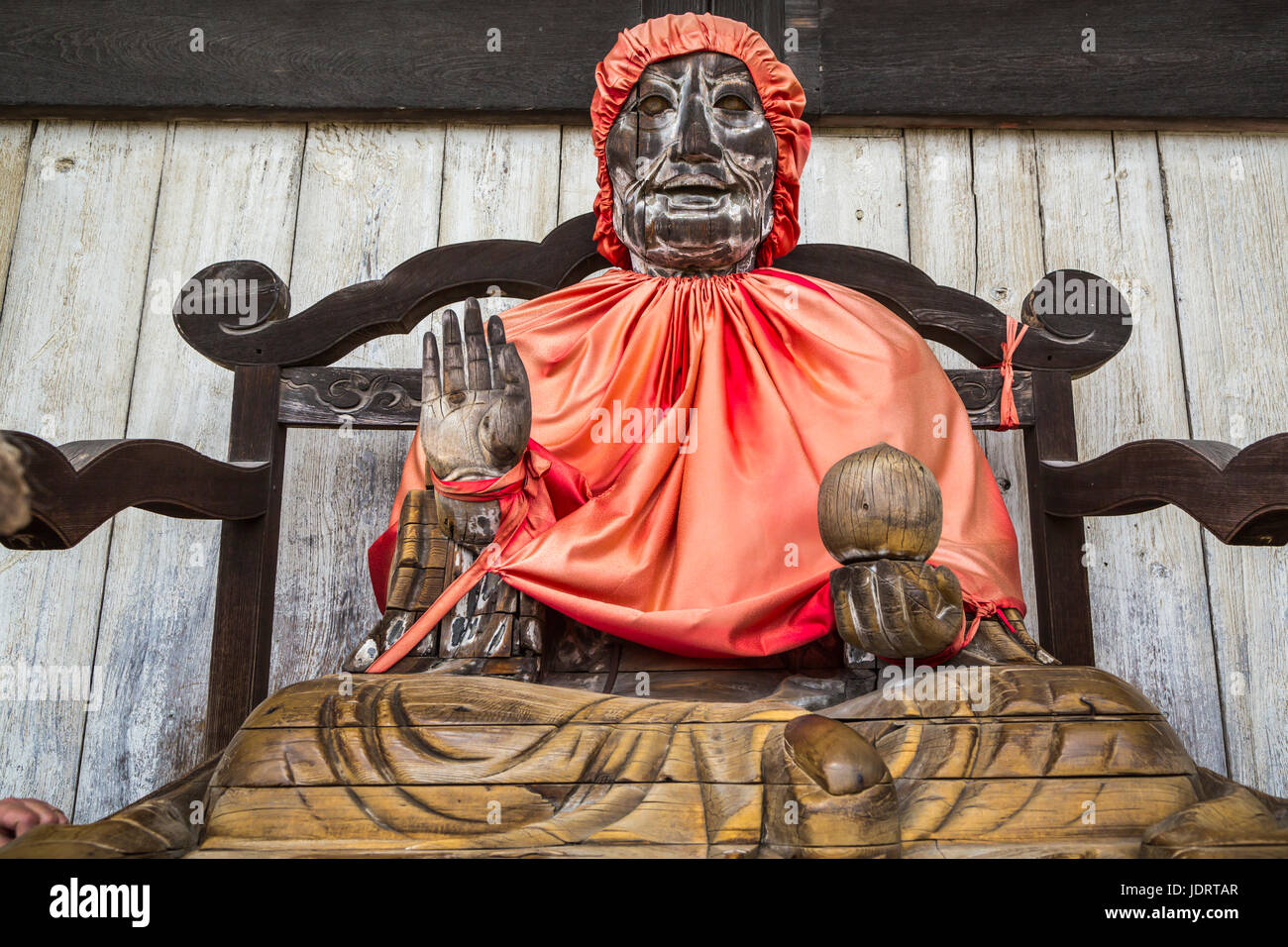 Wooden statue of a seated Binzuru (PIndola Bharadvja) outside the ...