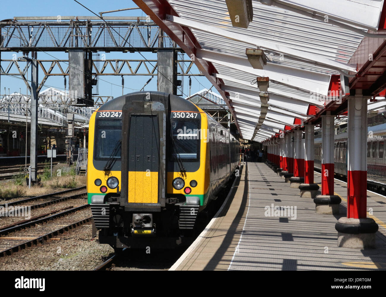 London Midland liveried class 350 Desiro electric multiple unit waits, in platform 2 at Crewe ...