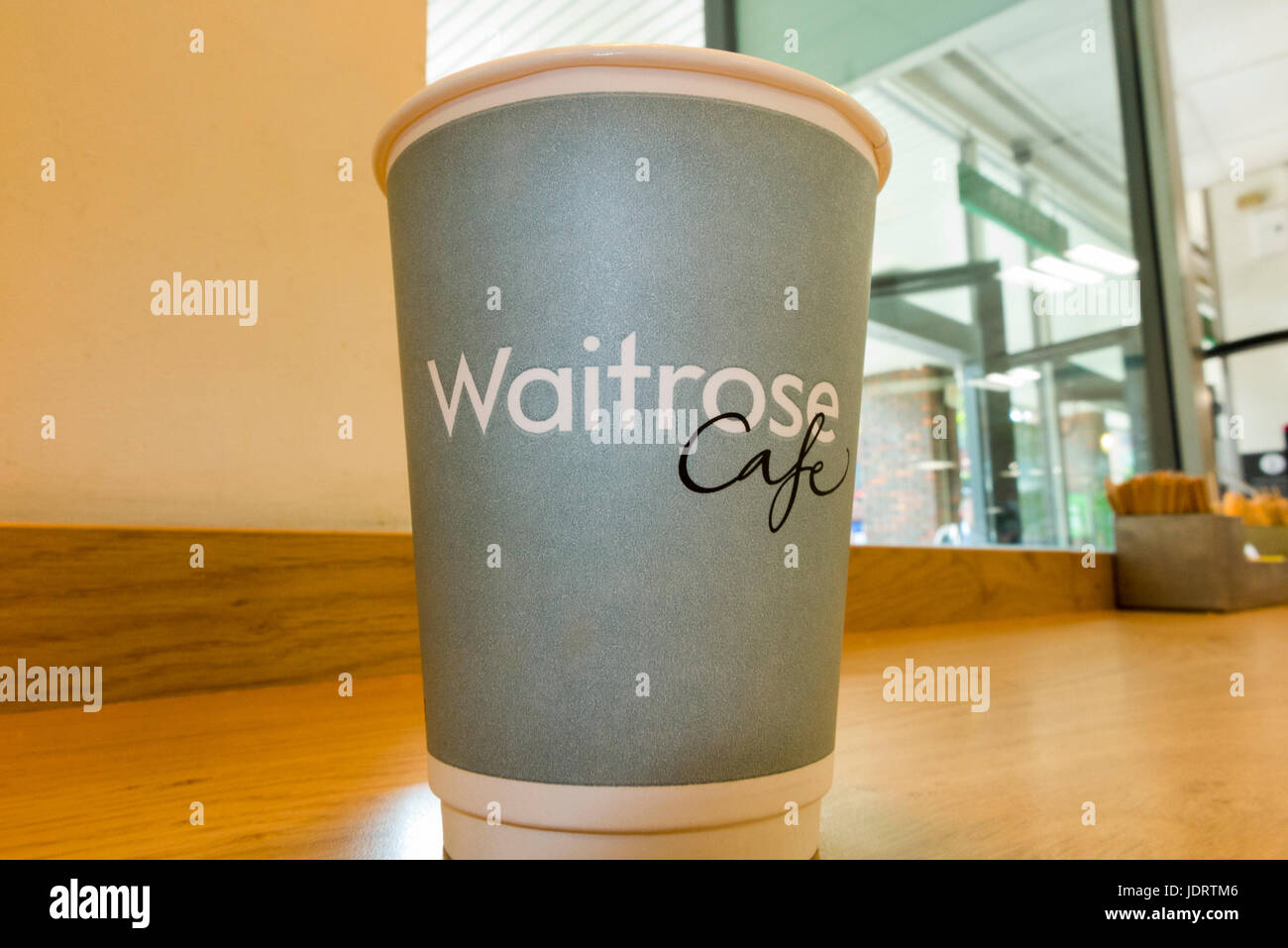 A cup of free coffee at a Waitrose supermarket. UK. This cup is a ...