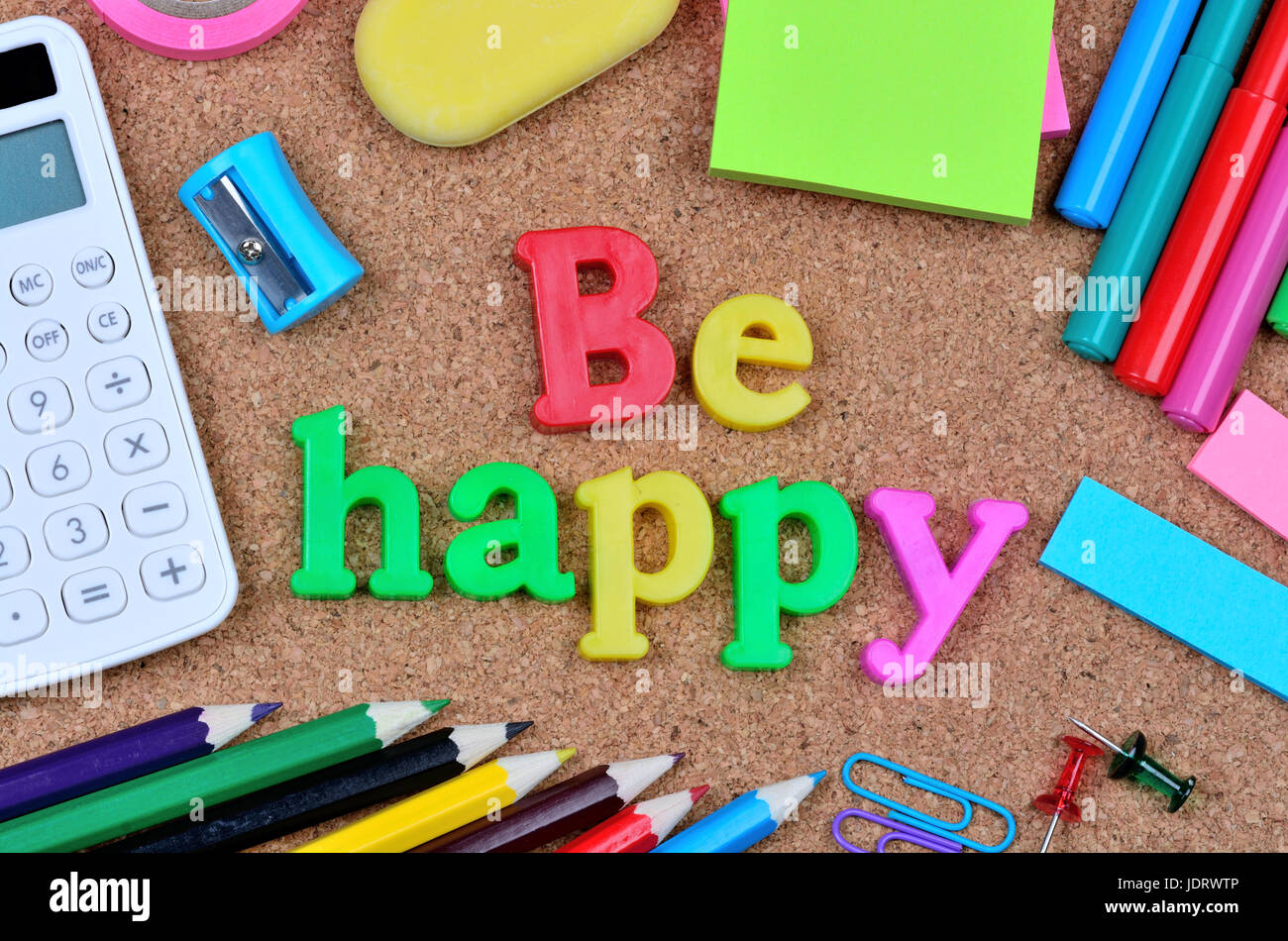 Be happy words on cork background Stock Photo - Alamy