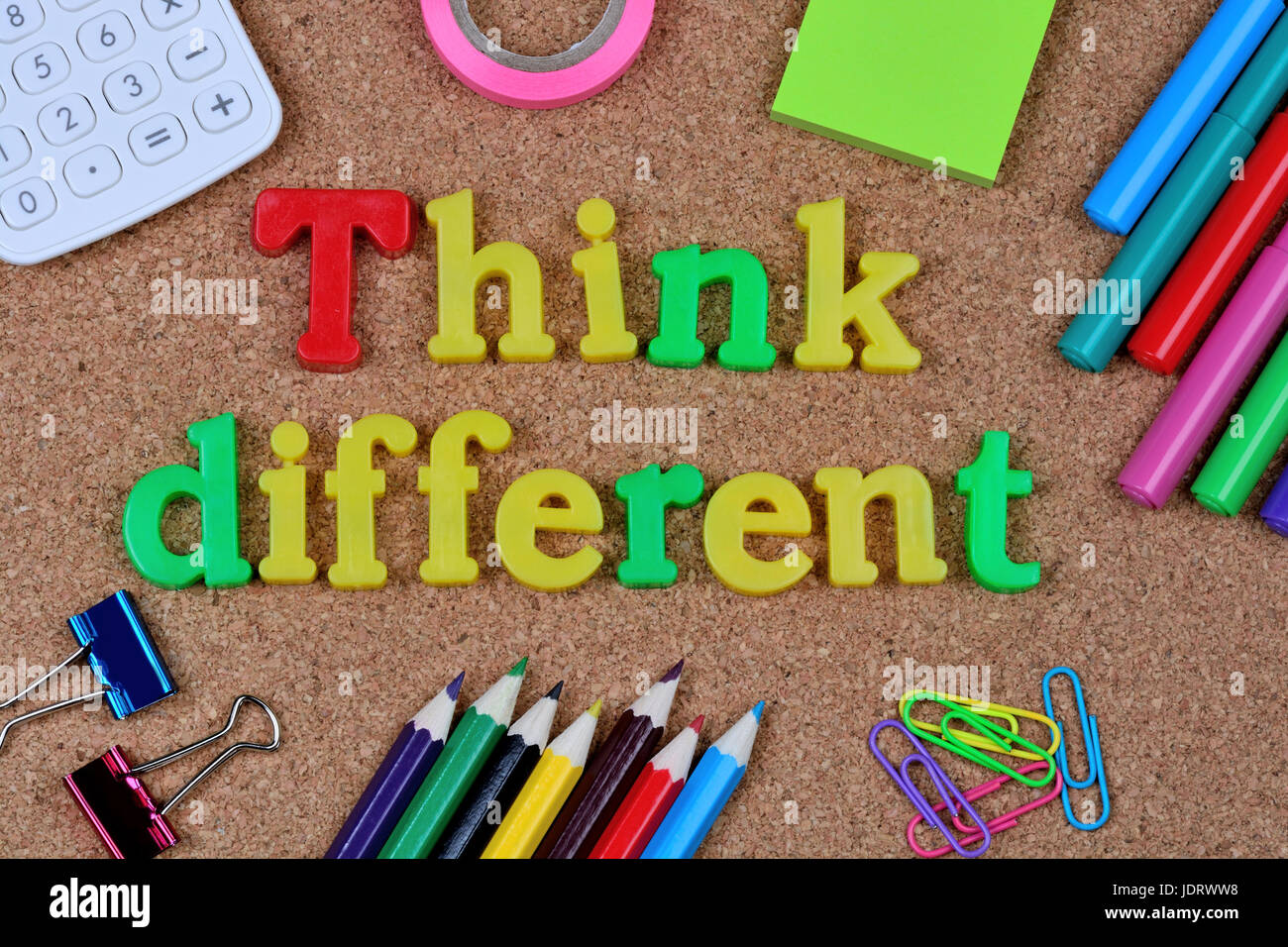 The words Think different word on cork background Stock Photo - Alamy