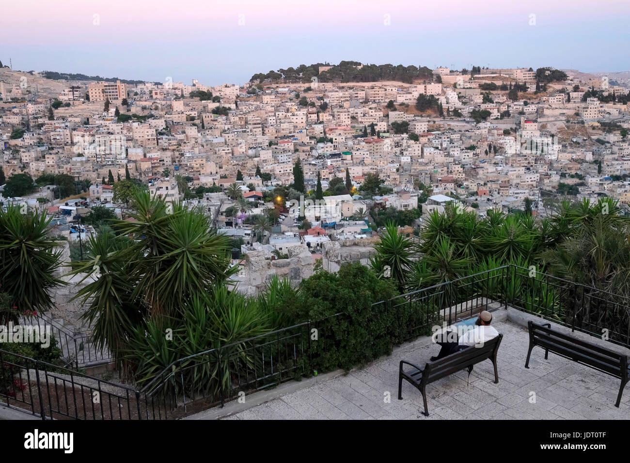 An Orthodox Jew gazing at the Palestinian neighborhood of Silwan or ...