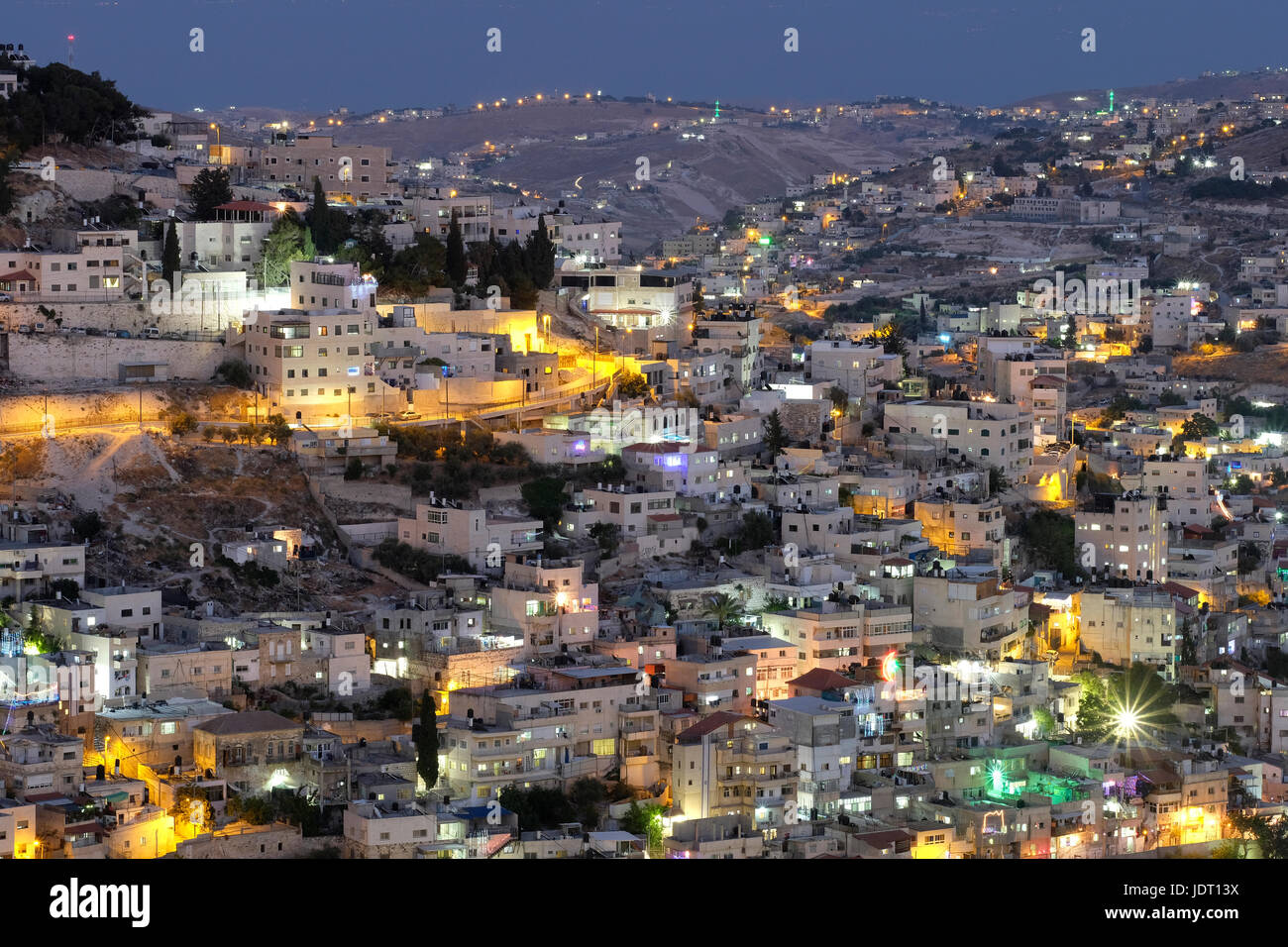View at twilight of the Palestinian neighborhood of Silwan or Siloam a ...