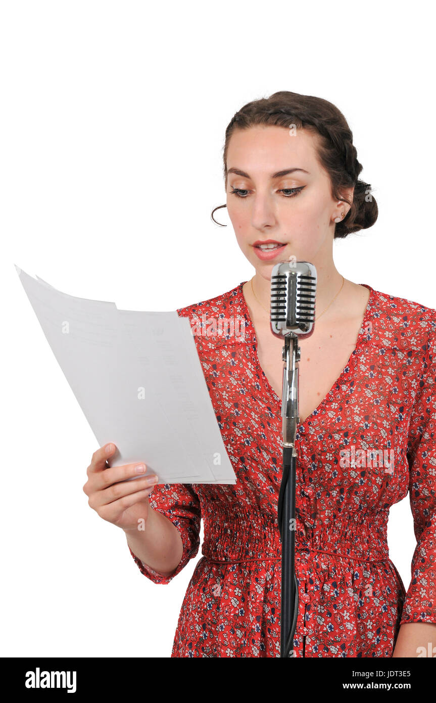 Woman speaking into a vintage microphone performing a radio play Stock ...