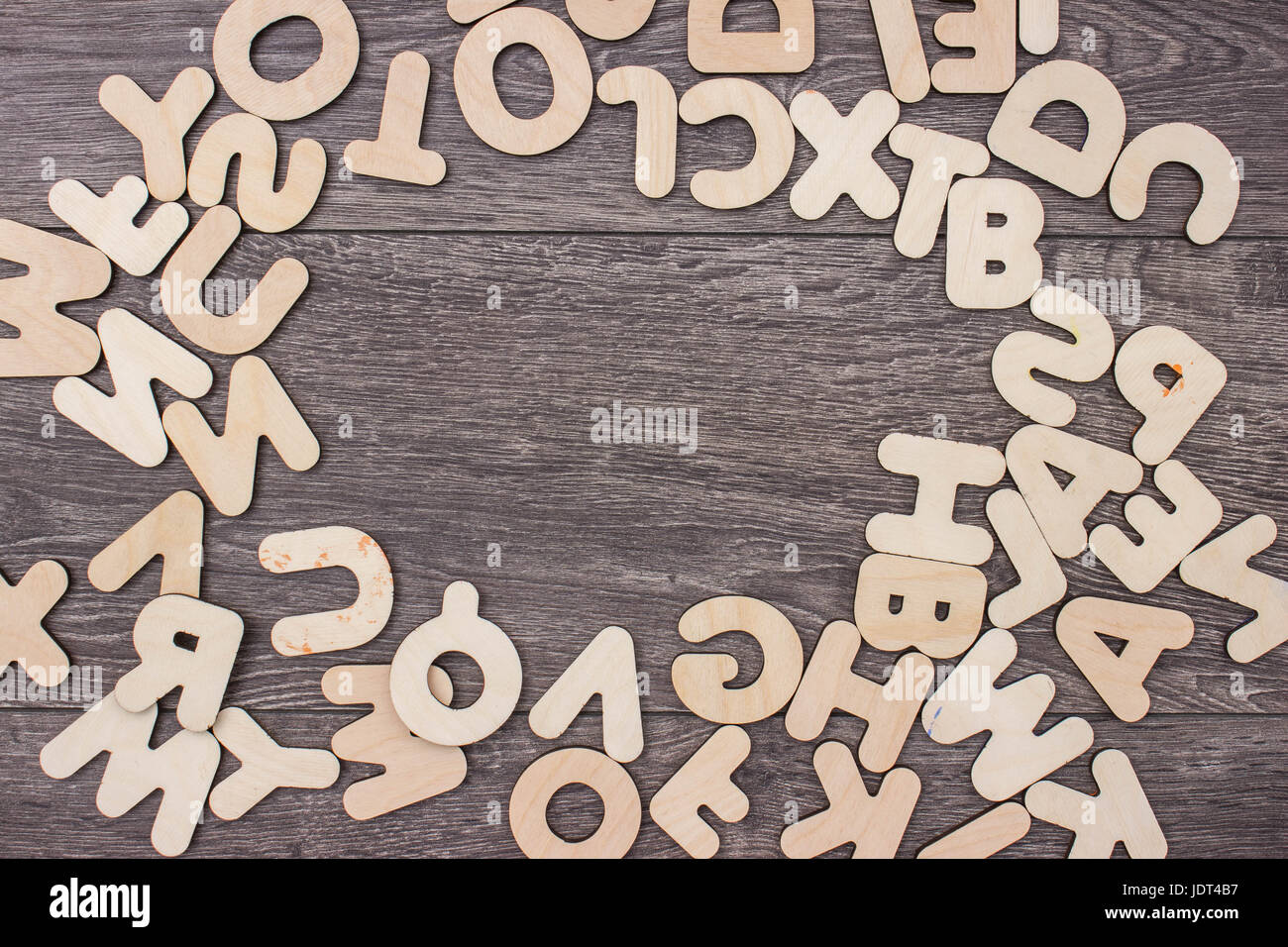 Wooden letters on wooden board background Stock Photo - Alamy