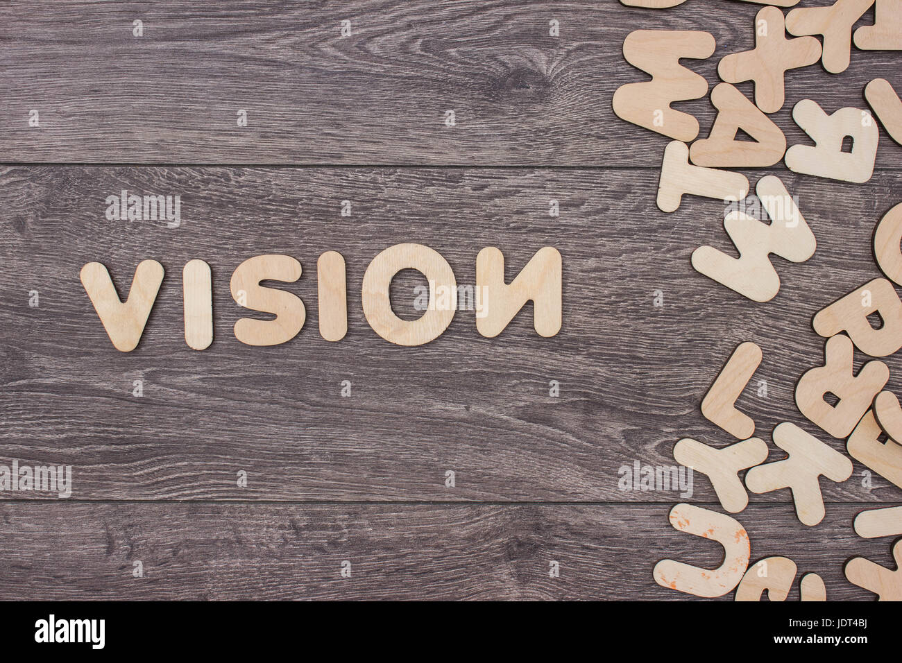 Word Vision made with wooden letters next to a pile of other letters ...