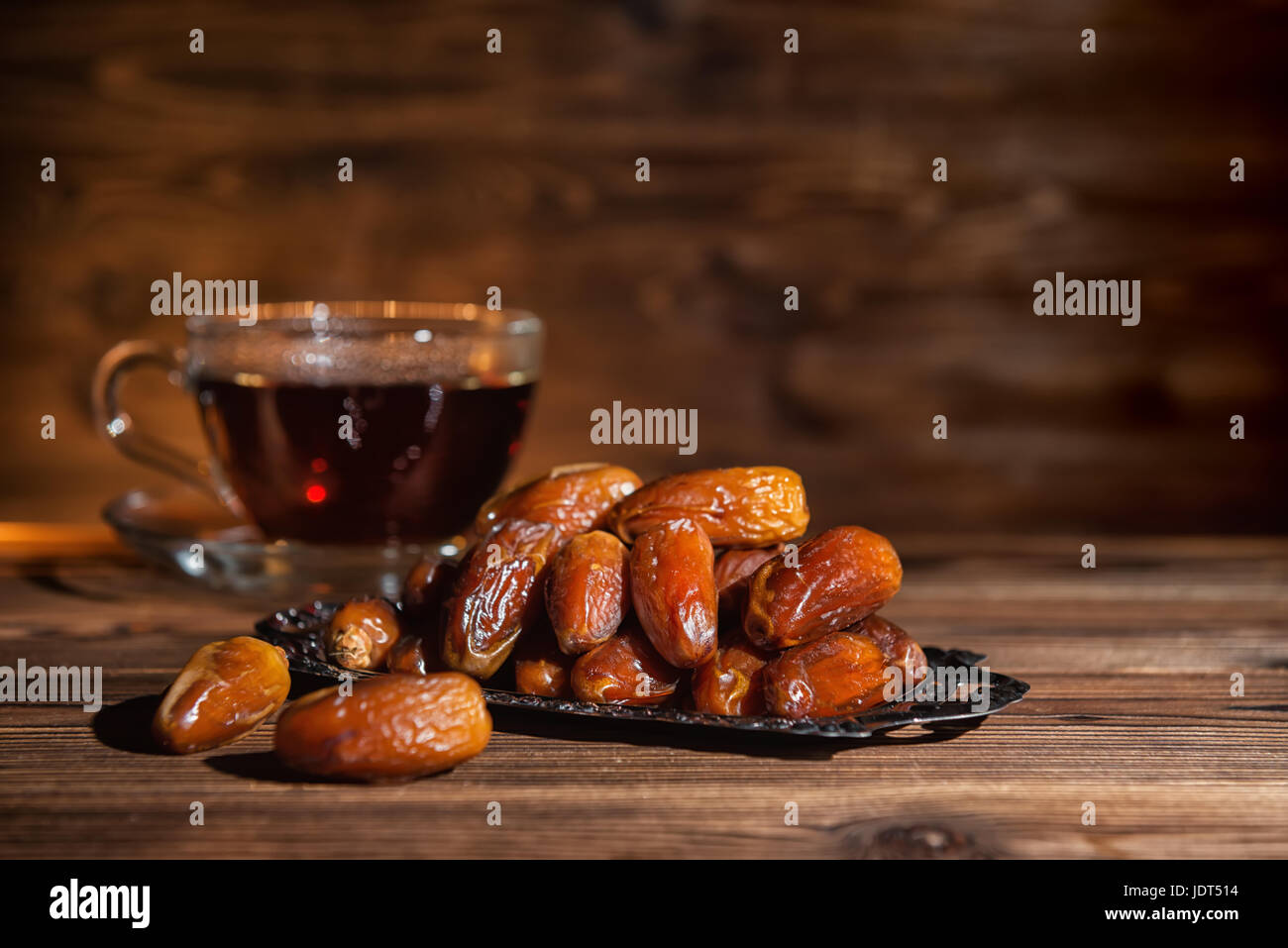 concept of muslim feast holy month Ramadan Kareem with dates and cup of ...