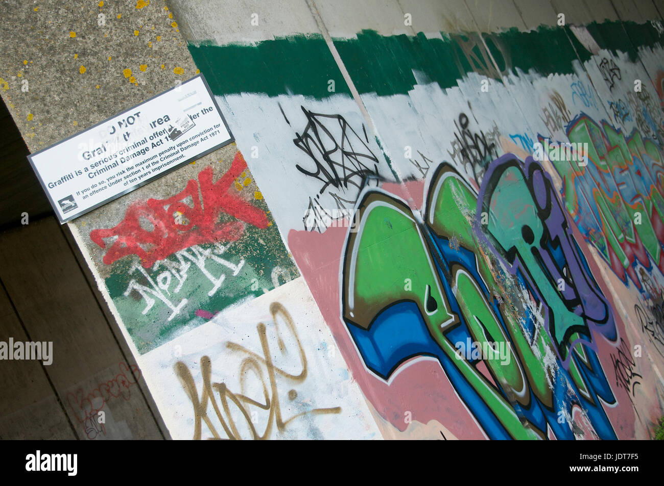 Graffiti artwork? - despite warning sign Stock Photo - Alamy