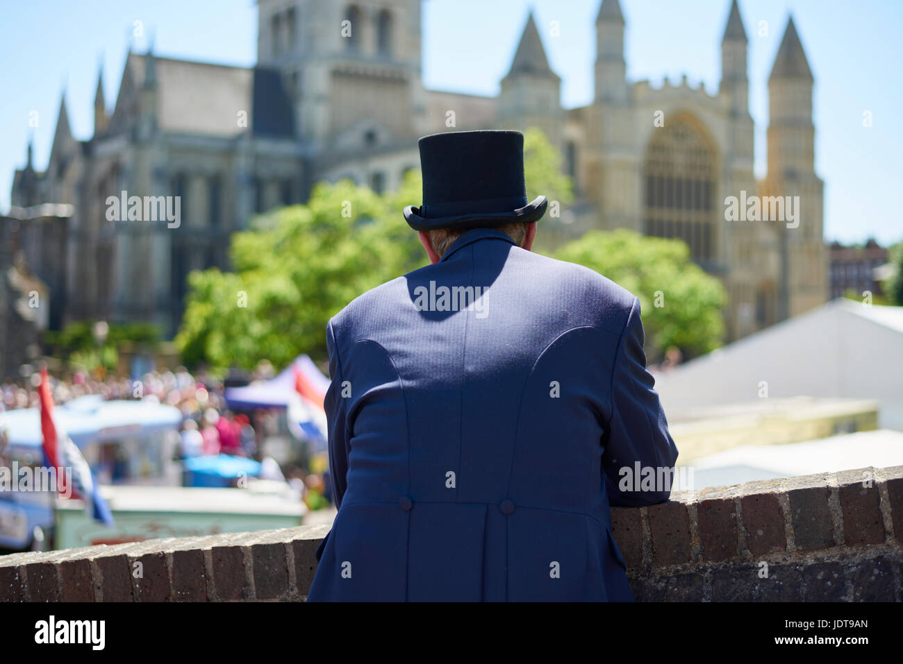 Man wearing a top hat looking out onto Rochester Cathedral at the ...