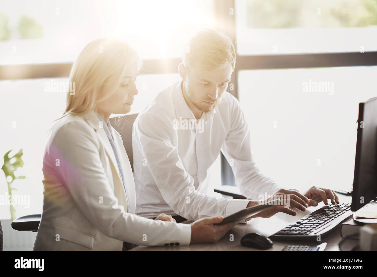 Team computer serious hi-res stock photography and images - Alamy