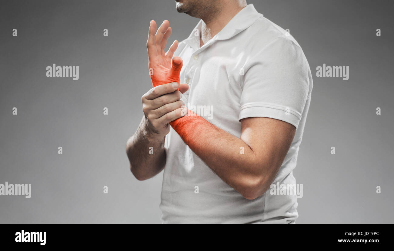 close up of man suffering from pain in hand Stock Photo - Alamy
