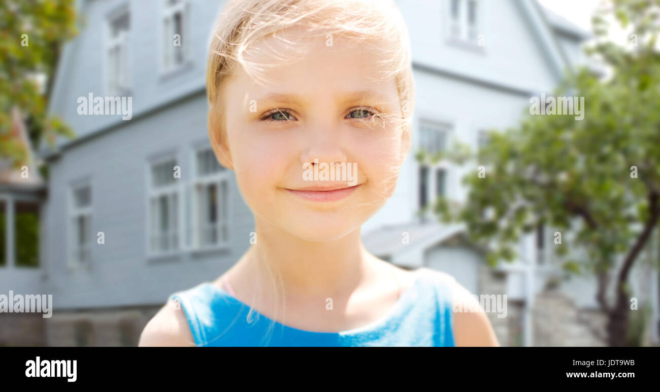 happy little girl over living house background Stock Photo - Alamy