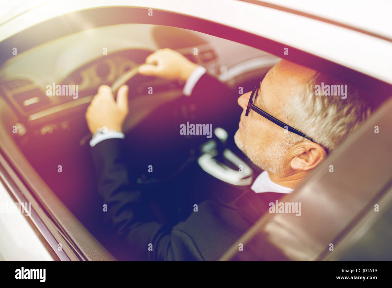 happy senior businessman driving car Stock Photo - Alamy
