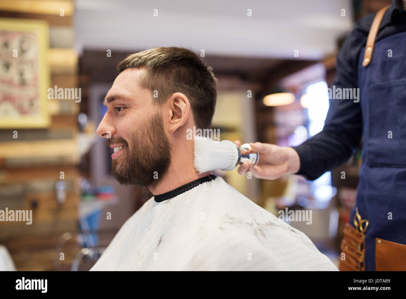 barber with brush cleaning male neck at barbershop Stock Photo - Alamy