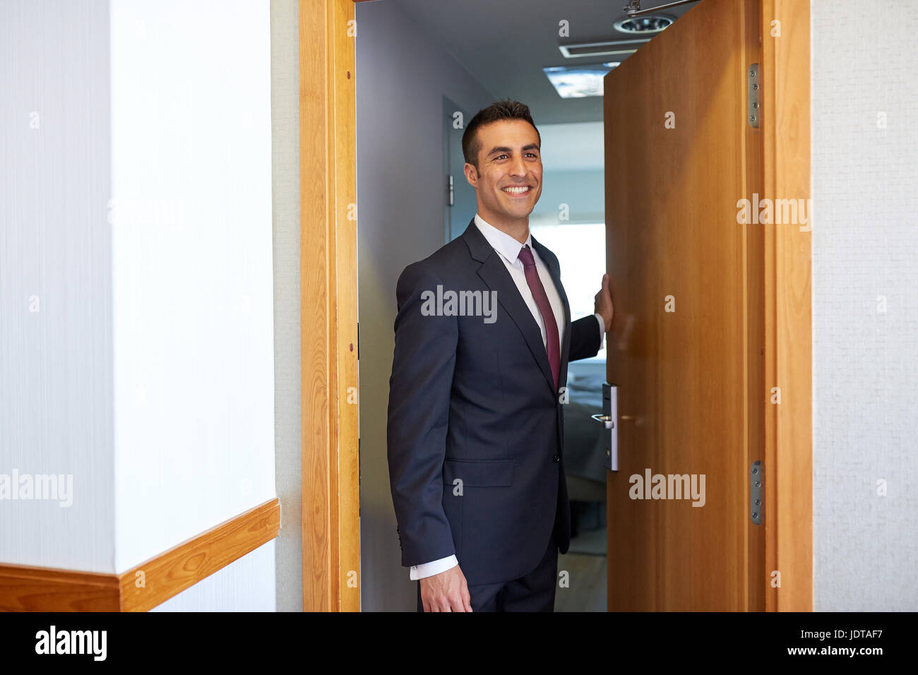 Young male enter hotel room hi-res stock photography and images - Alamy