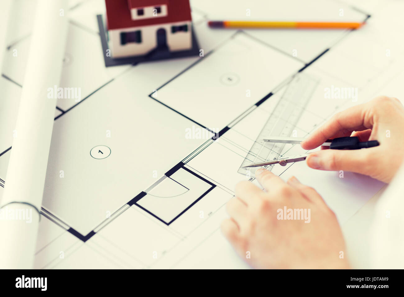 close up of hands with compass measuring blueprint Stock Photo - Alamy
