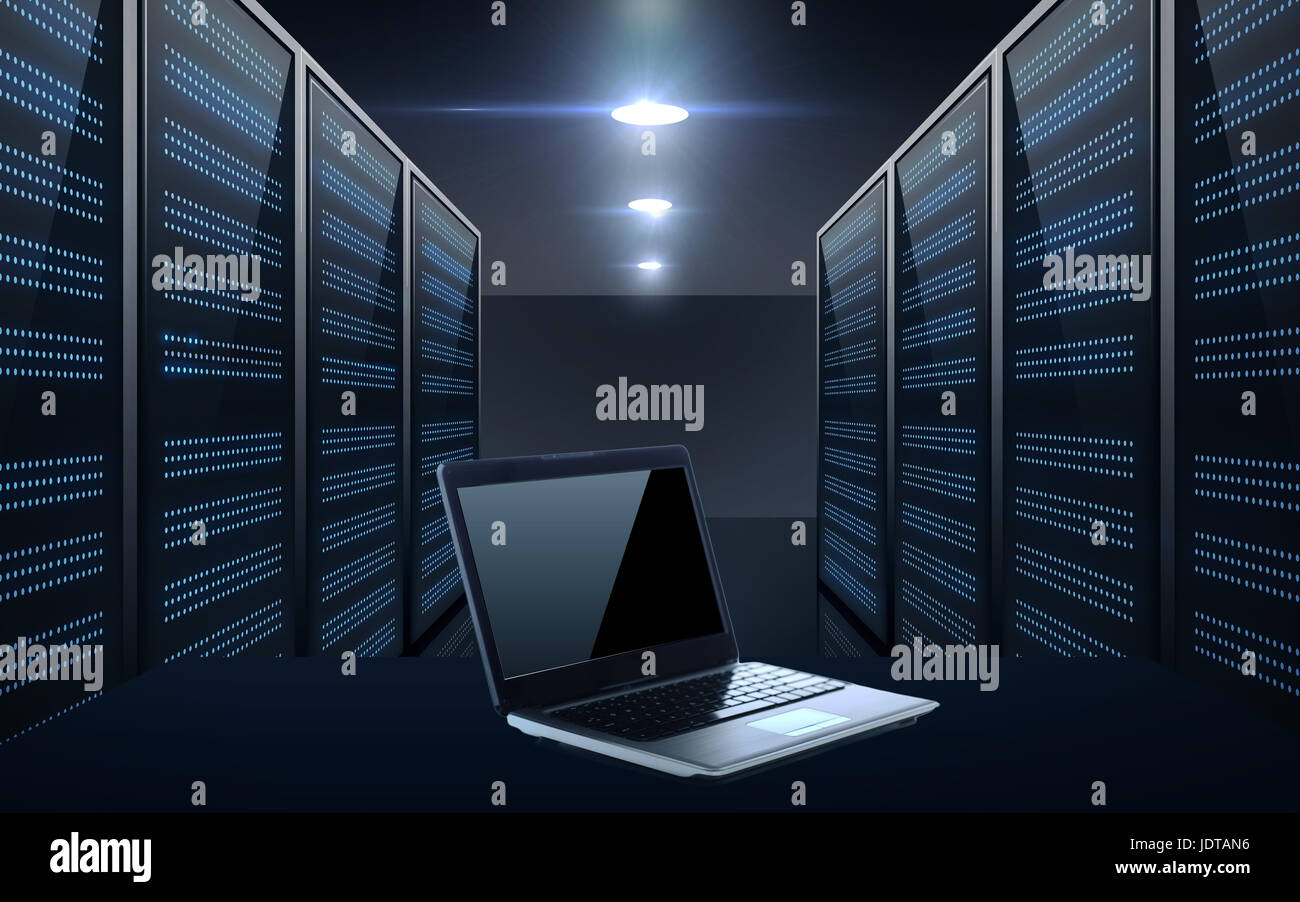 laptop computer over server room background Stock Photo - Alamy