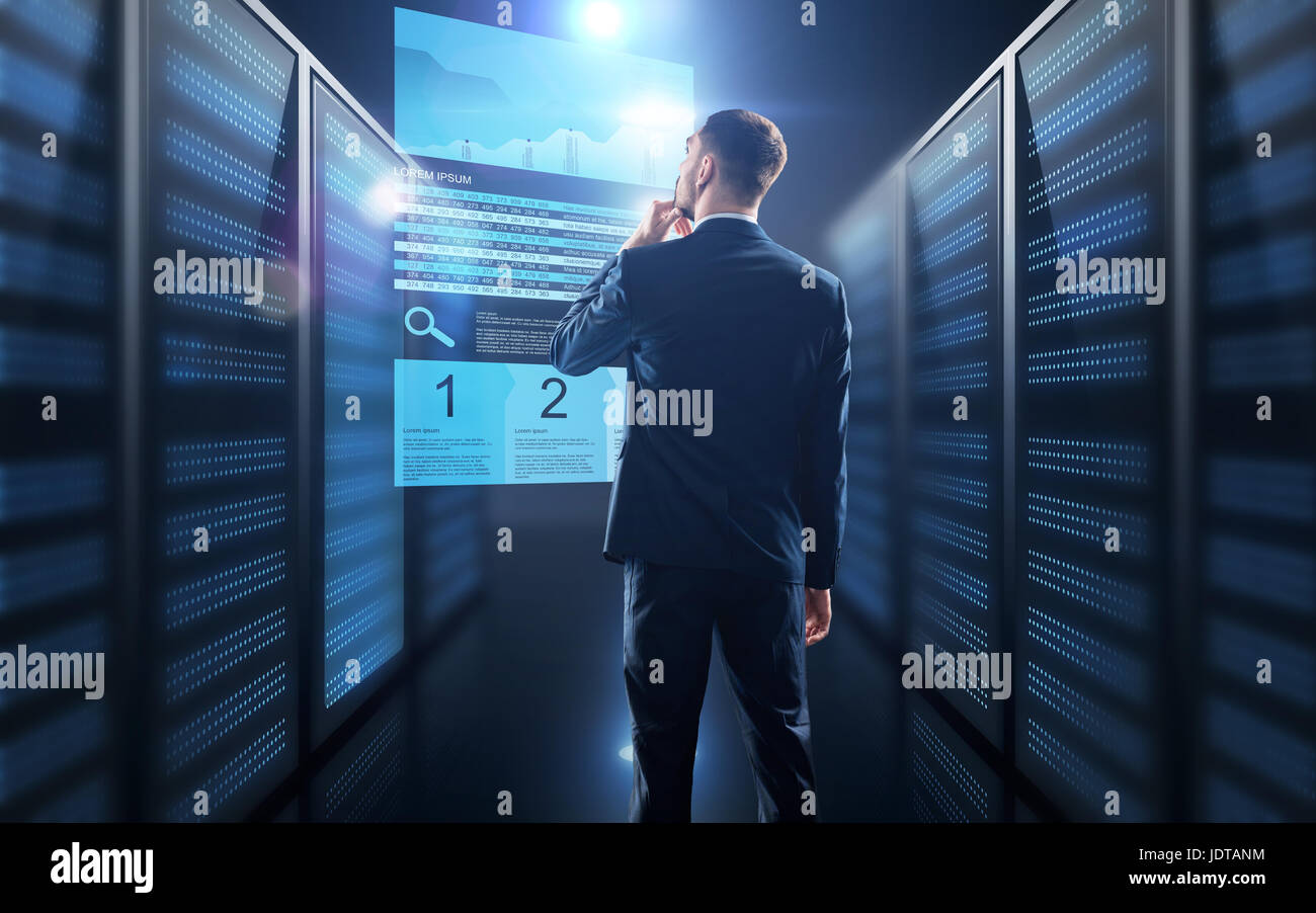 businessman with charts on virtual screen Stock Photo - Alamy