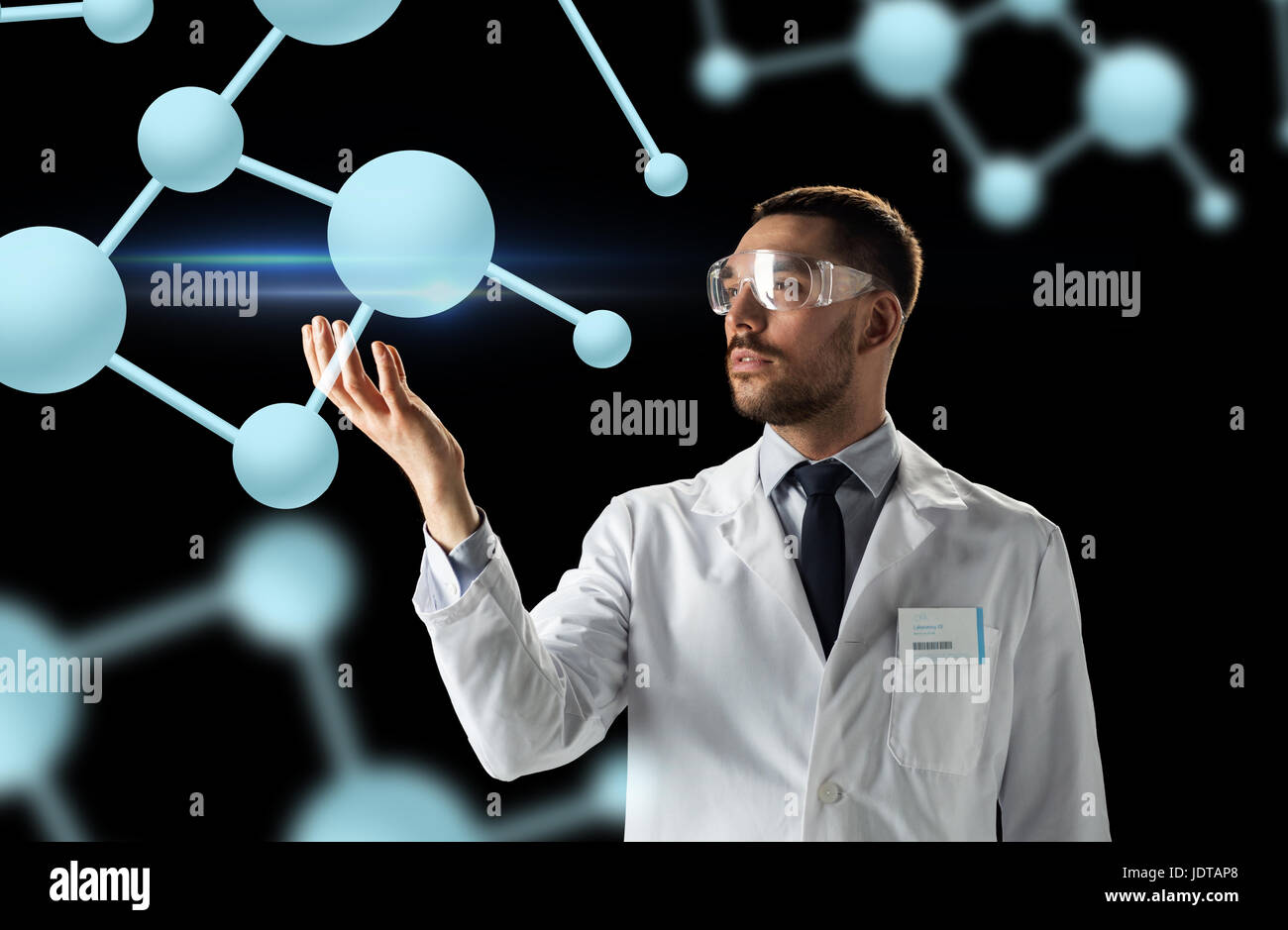 scientist in lab coat and goggles with molecules Stock Photo - Alamy