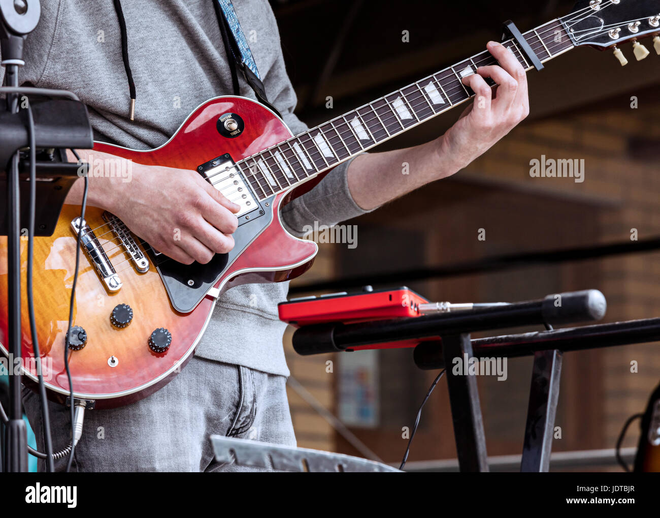 young guitarist performing during live concert on outdoor stage Stock ...