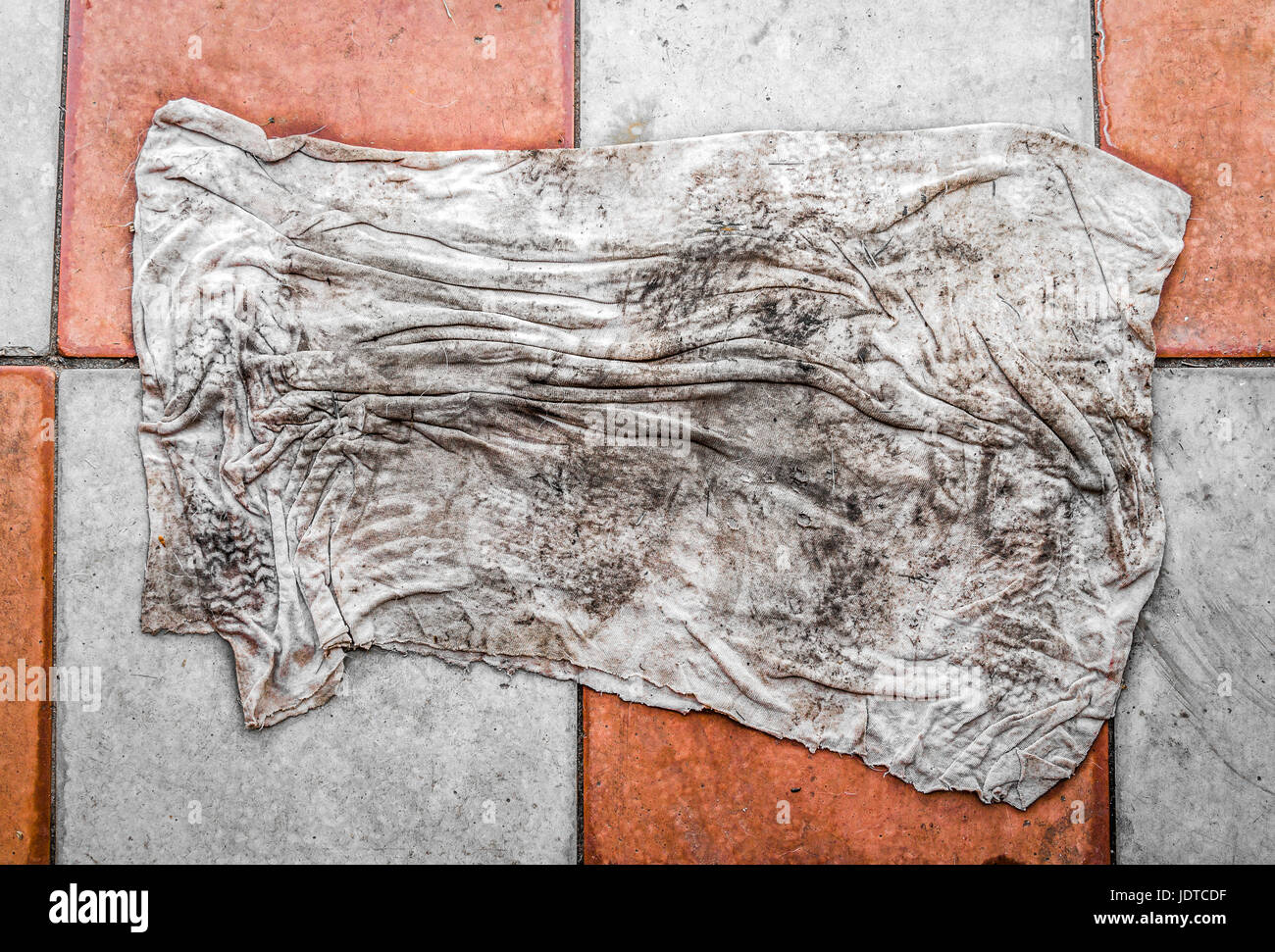 Dirty doormat lies on the pavement slab closeup Stock Photo - Alamy