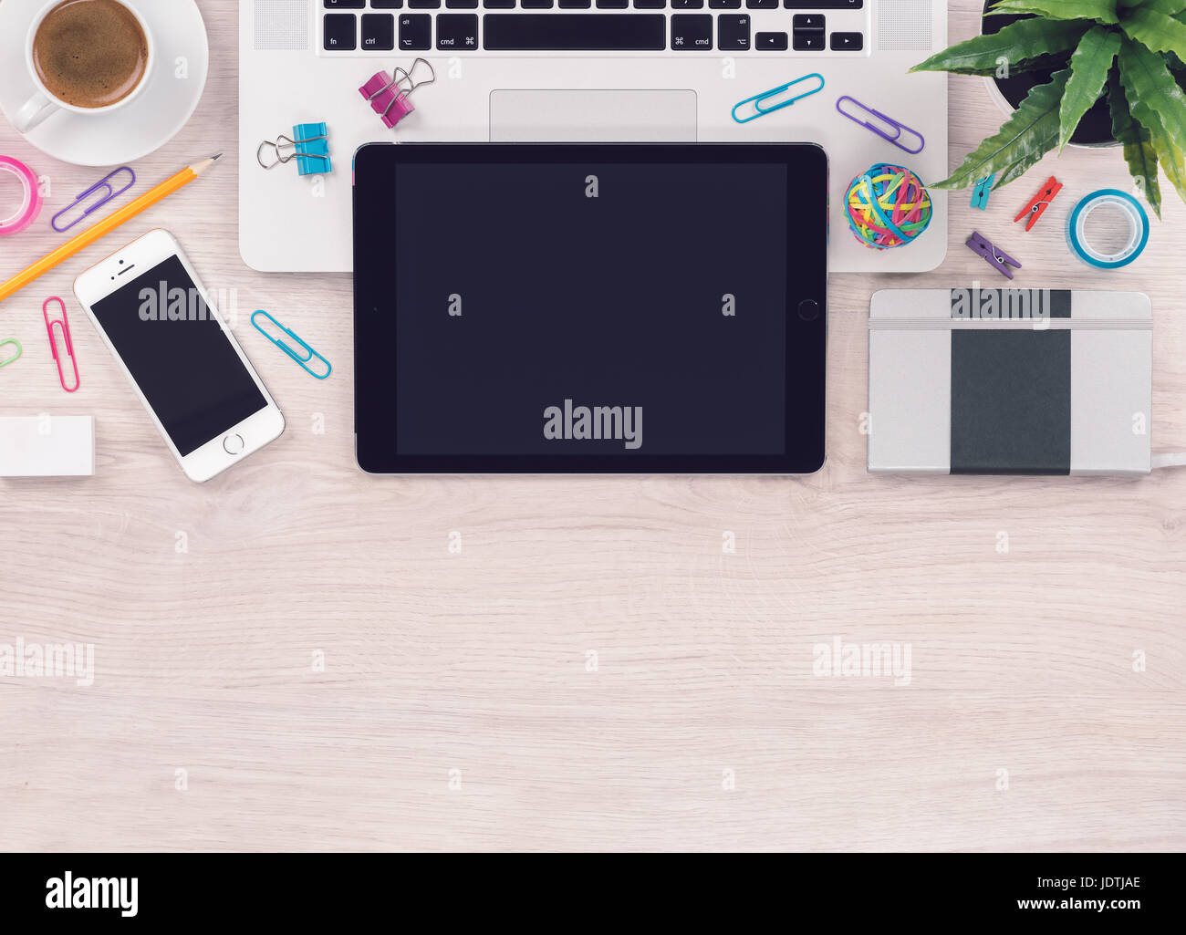 Office desk table workplace with laptop tablet smartphone notebook top ...