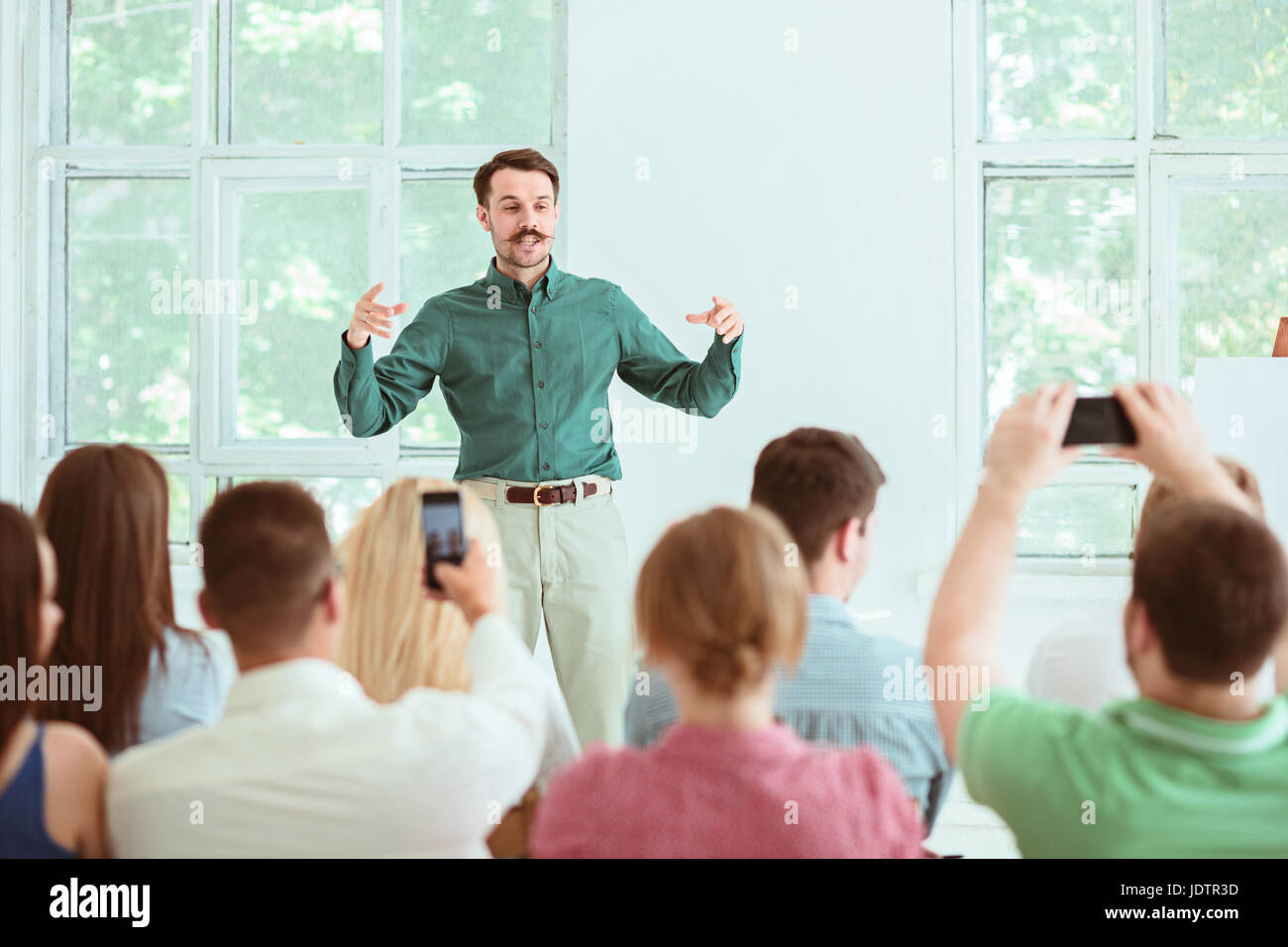 Speaker at Business Meeting in the conference hall Stock Photo - Alamy
