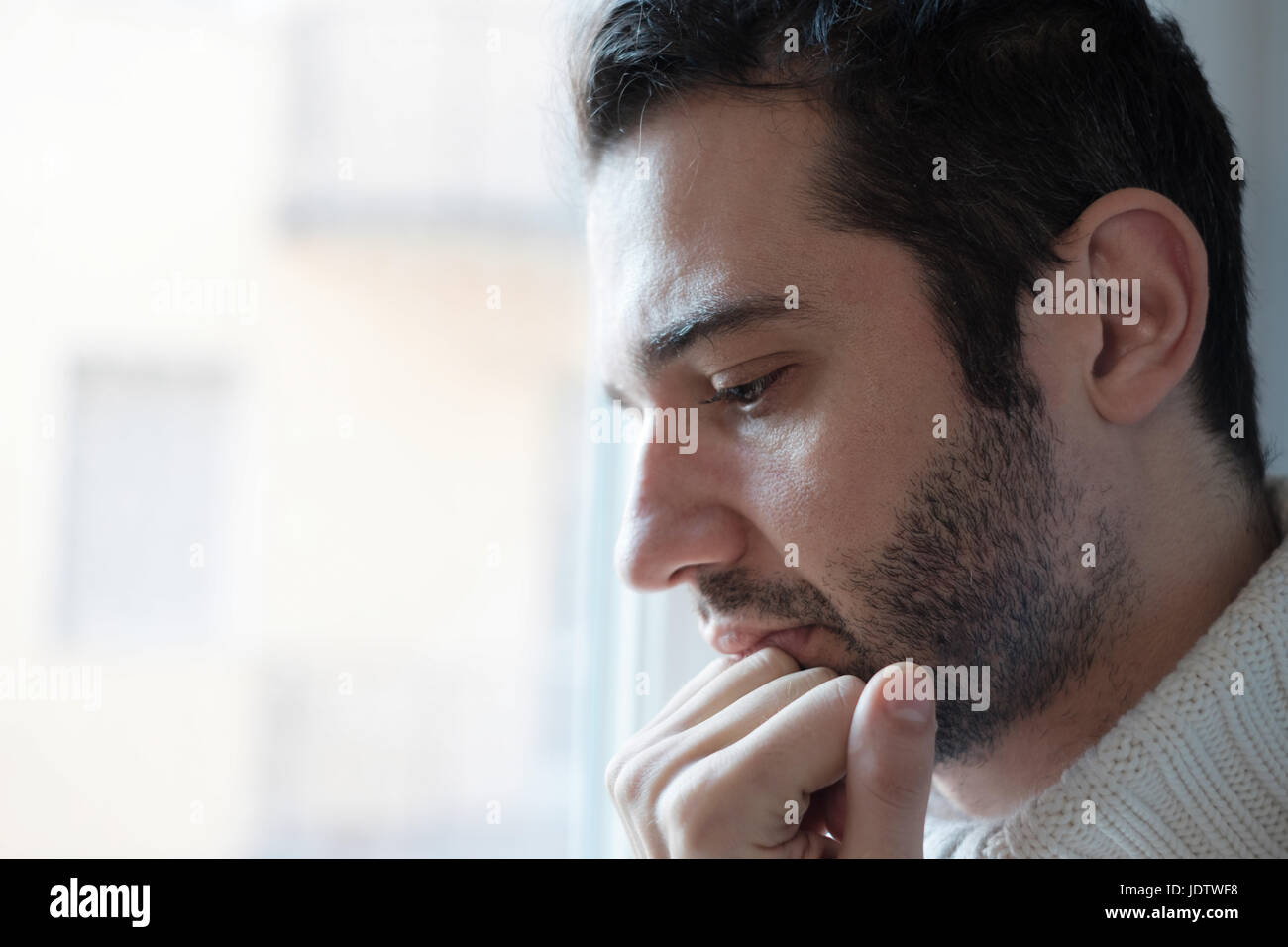 Sad man window hi-res stock photography and images - Alamy