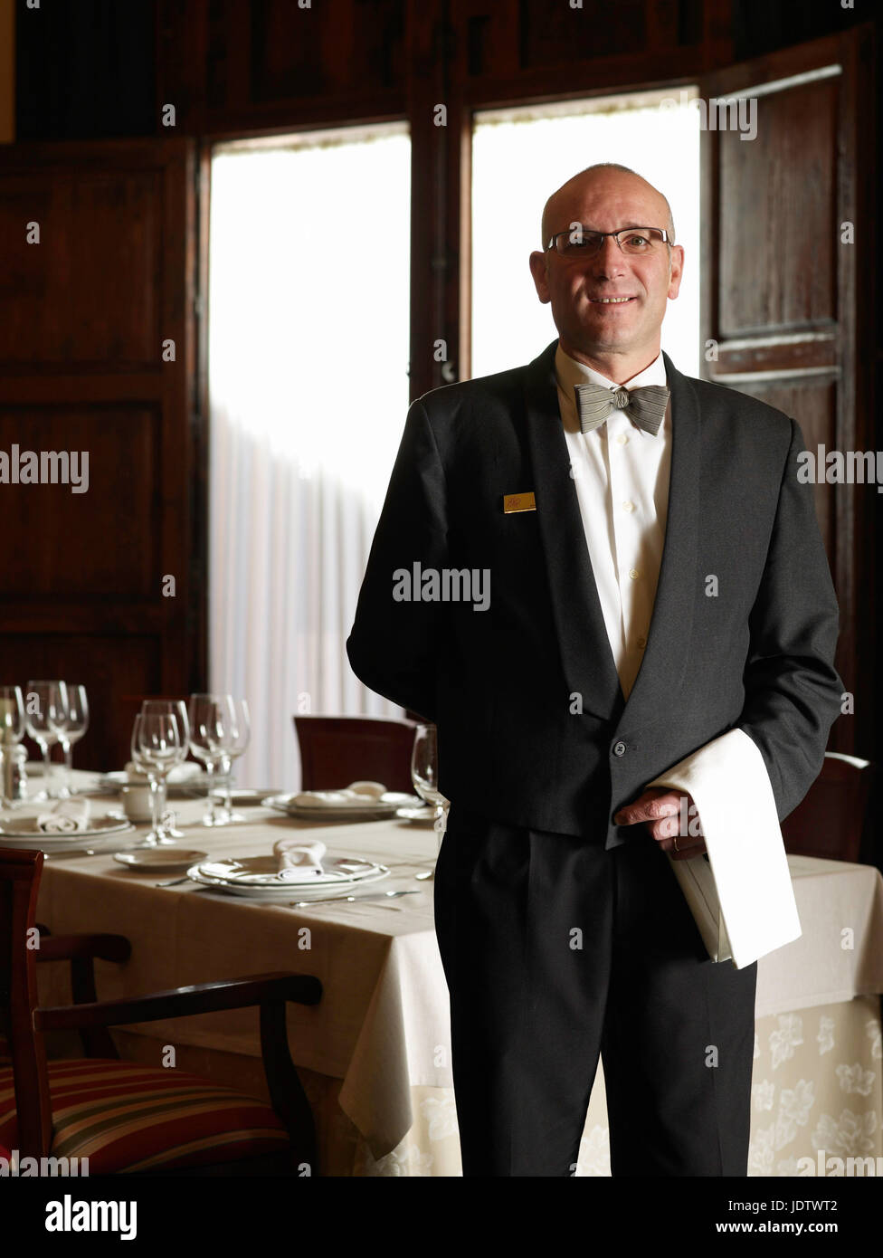 Portrait of a waiter Stock Photo - Alamy