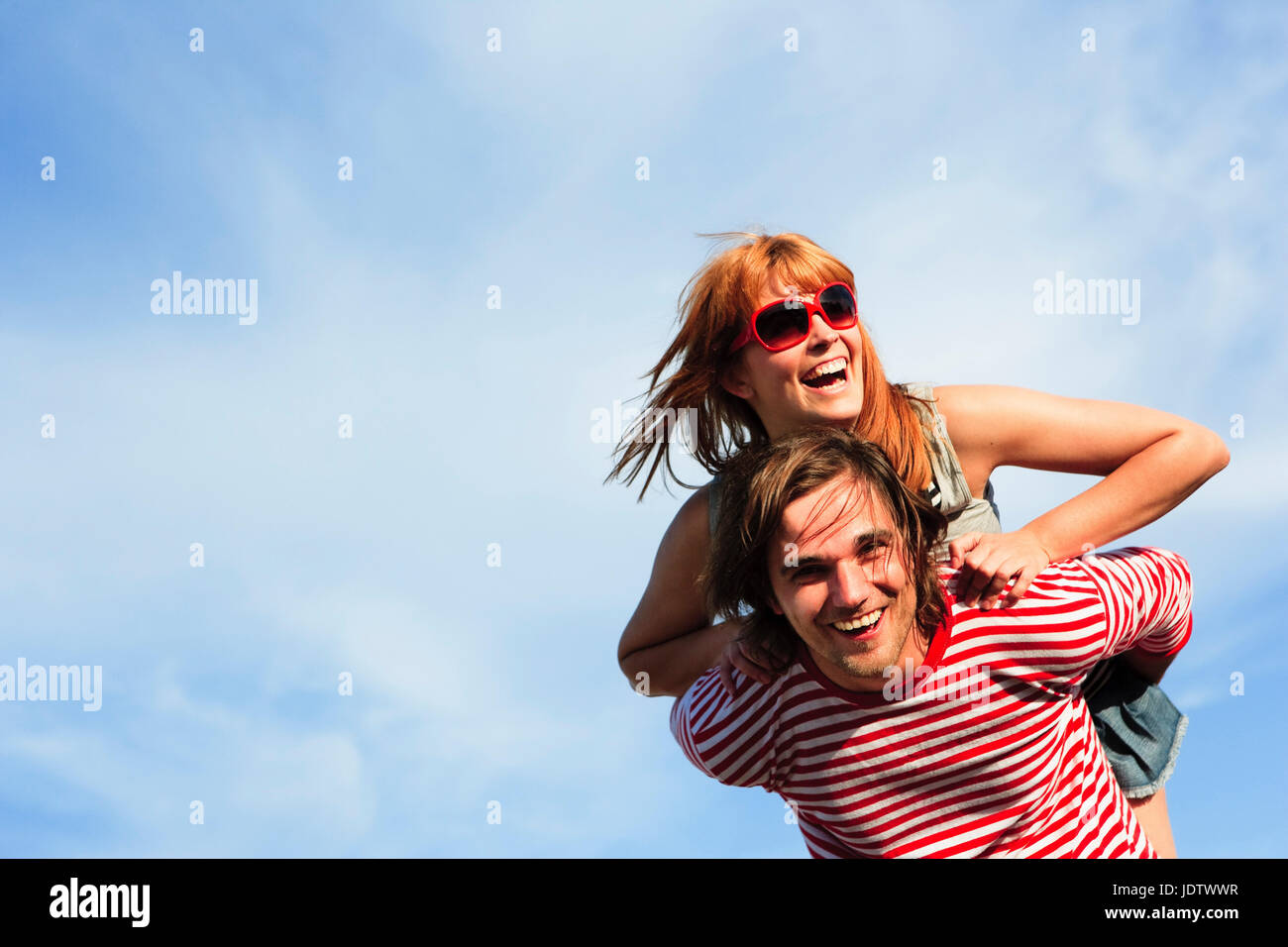 Man carrying woman Stock Photo - Alamy