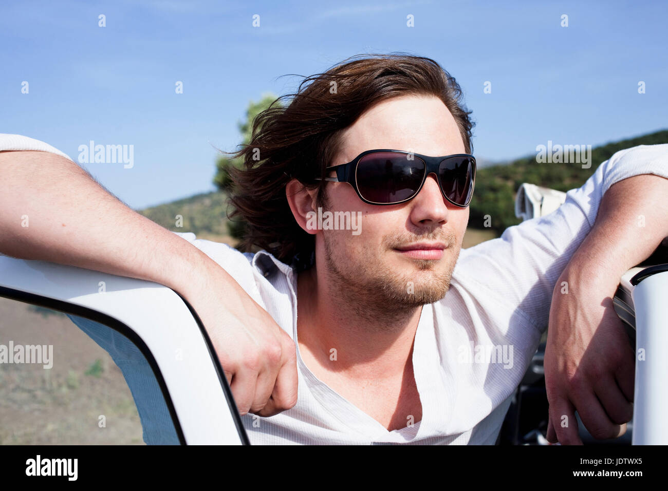 Man leaning on car close up Stock Photo - Alamy