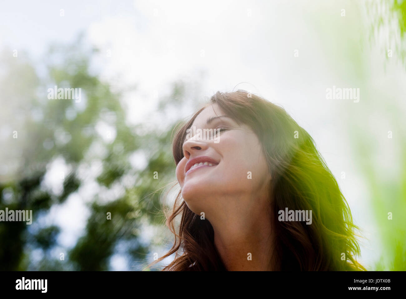 Woman at ease in nature Stock Photo - Alamy