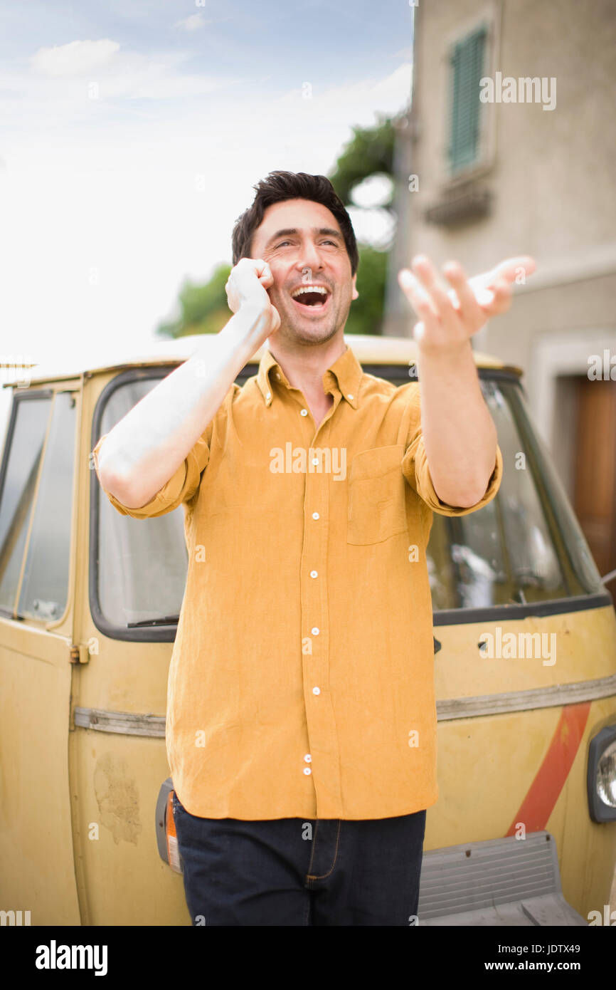 Man having a funny phone call Stock Photo - Alamy