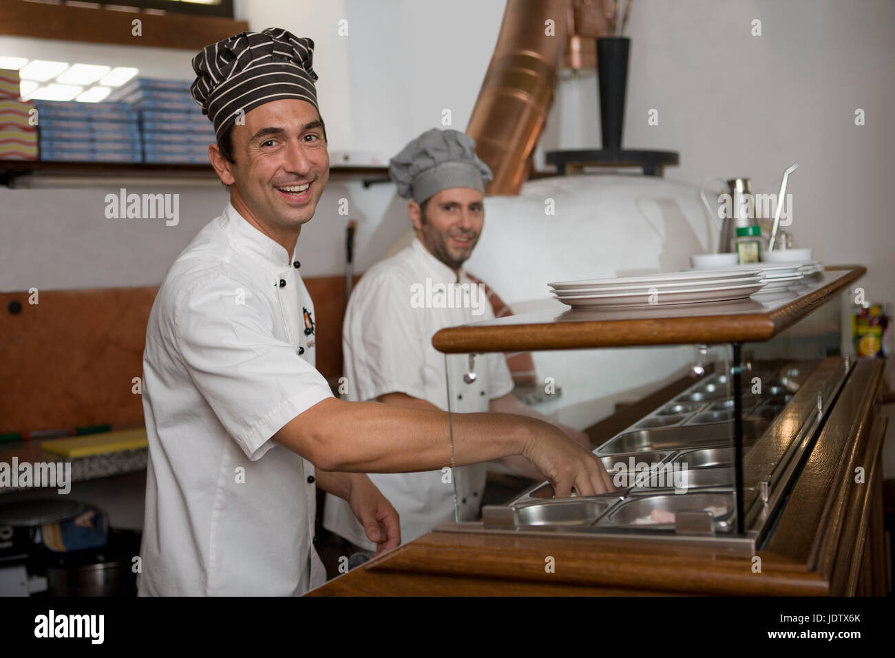 People in a pizzaria Stock Photo - Alamy