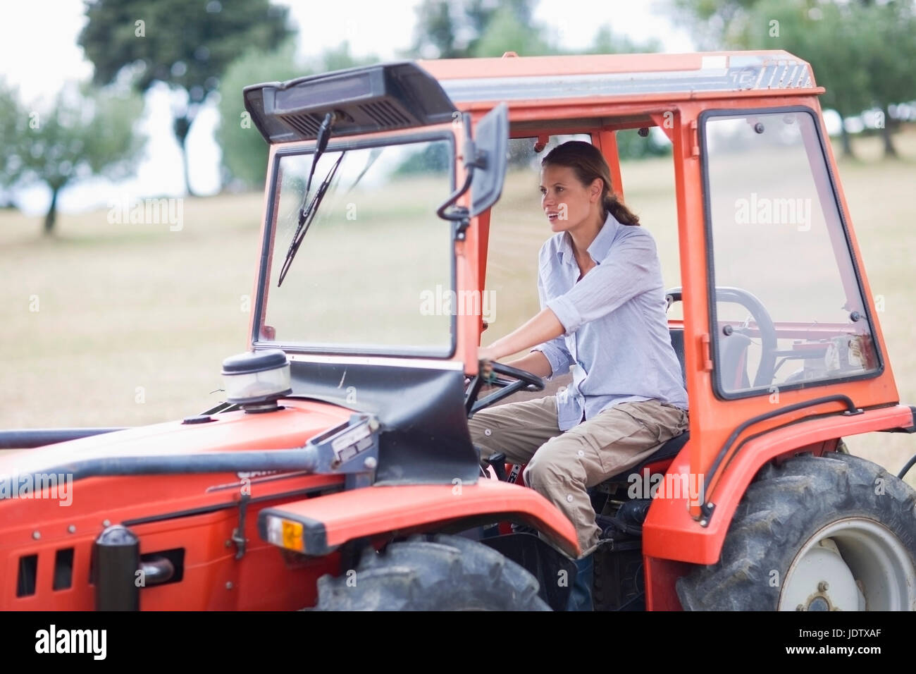 Girl driving tractor hi-res stock photography and images - Alamy