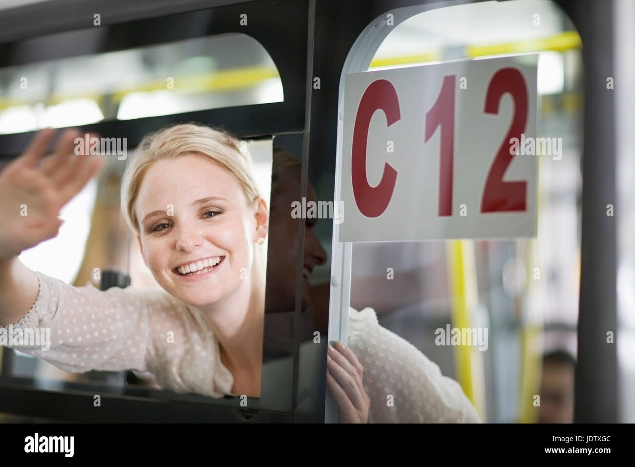 Woman waving bus hi-res stock photography and images - Alamy