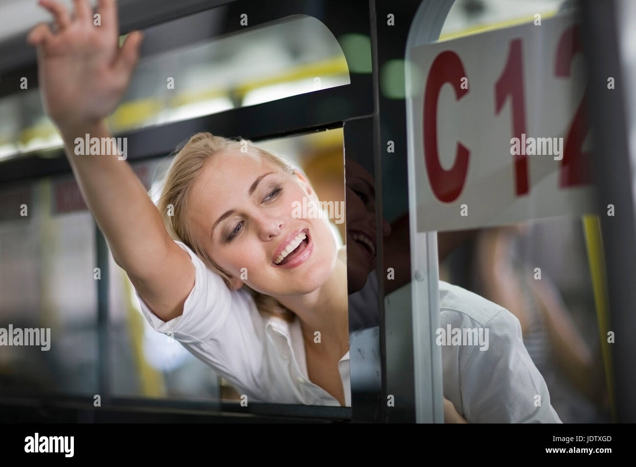Woman waving goog bye Stock Photo - Alamy