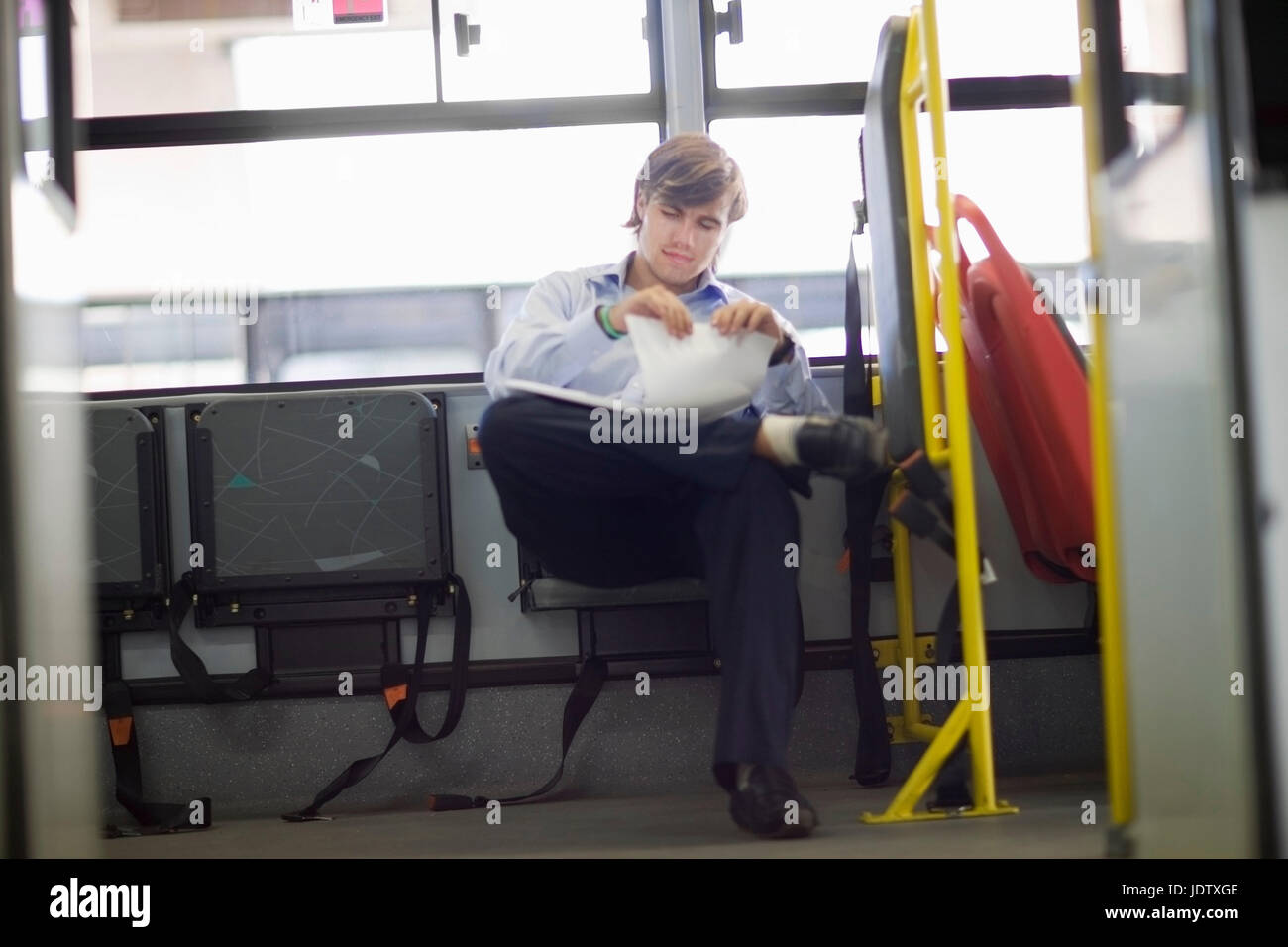 Man sitting in a bus Stock Photo - Alamy