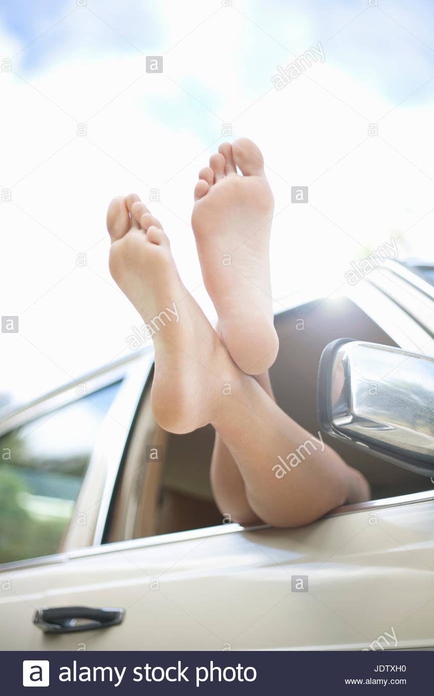Legs Sticking Out Of Car Stock Photos & Legs Sticking Out Of Car Stock ...