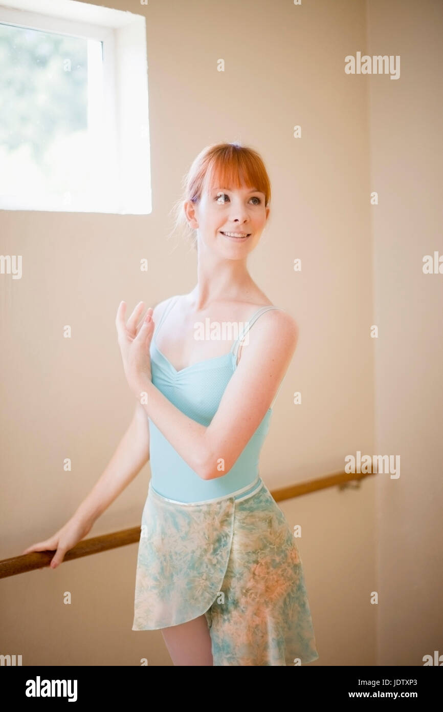 Ballet dancer standing at barre Stock Photo - Alamy