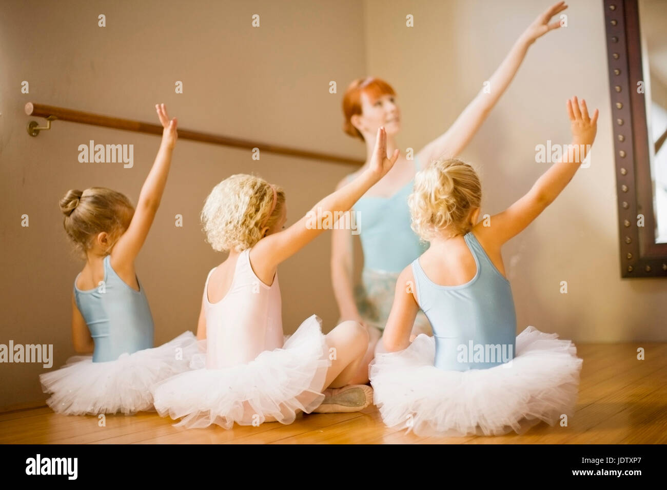 Girls posing in ballet class Stock Photo - Alamy