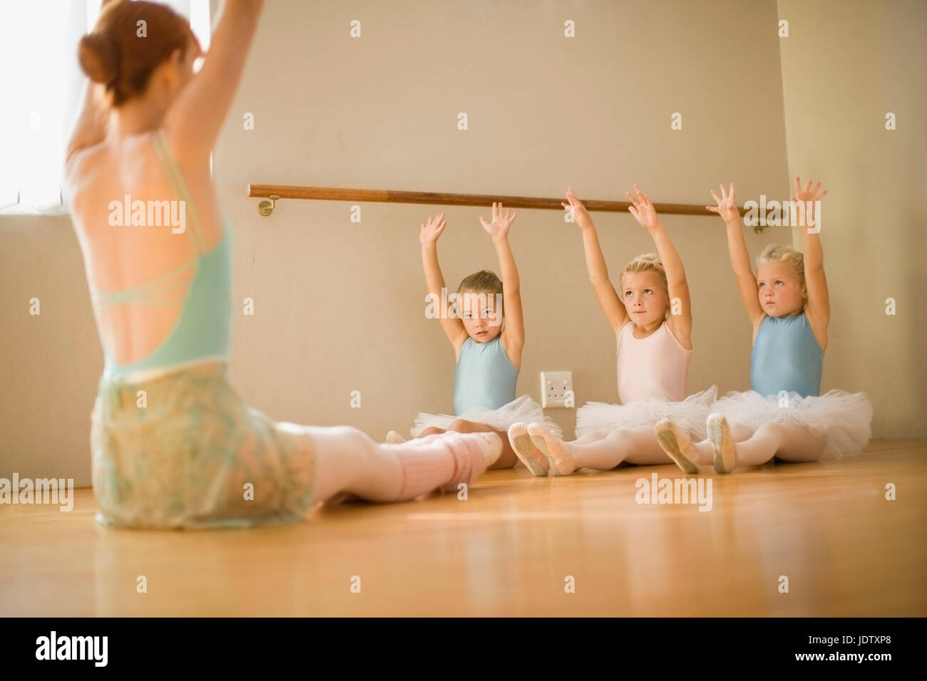Girls stretching in ballet class Stock Photo - Alamy