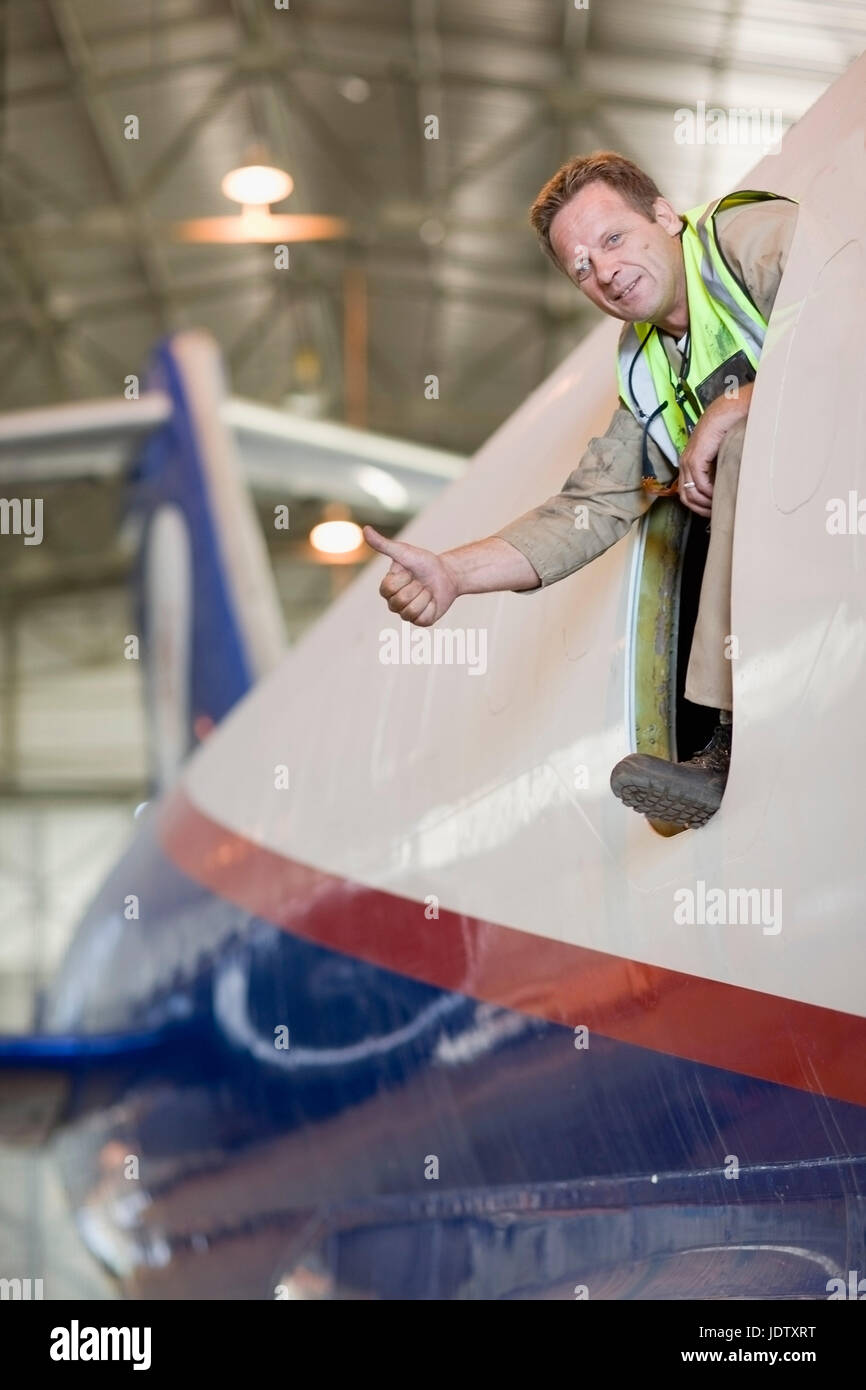 Aircraft worker giving ?thumbs up Stock Photo - Alamy