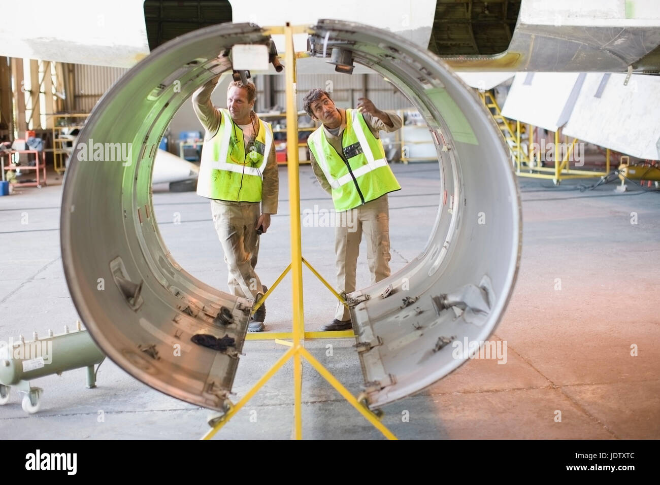 Airport ground crew workers examining hi-res stock photography and ...