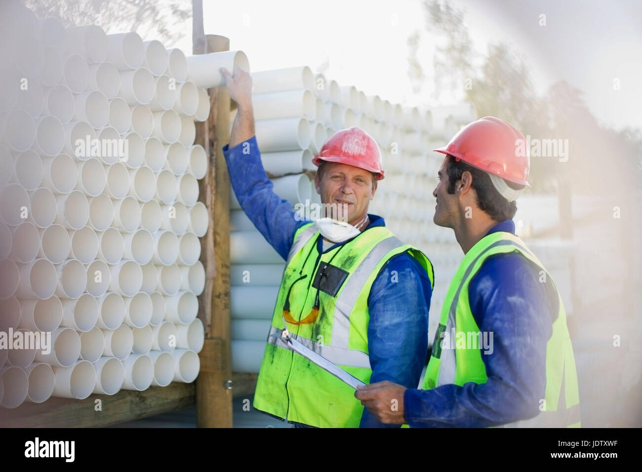 Workers checking product in factory Stock Photo - Alamy