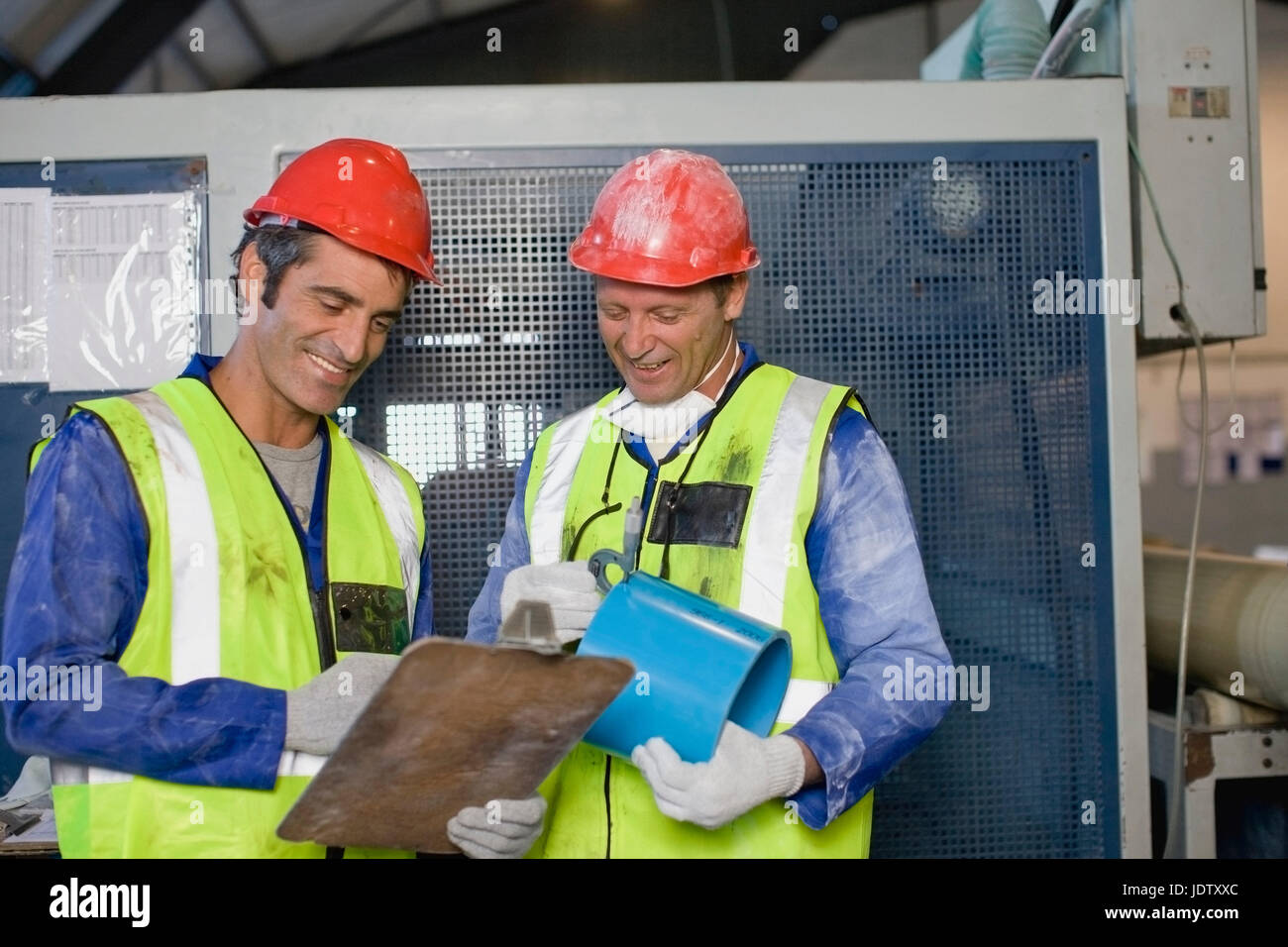 Industry reading smiling workers hi-res stock photography and images ...