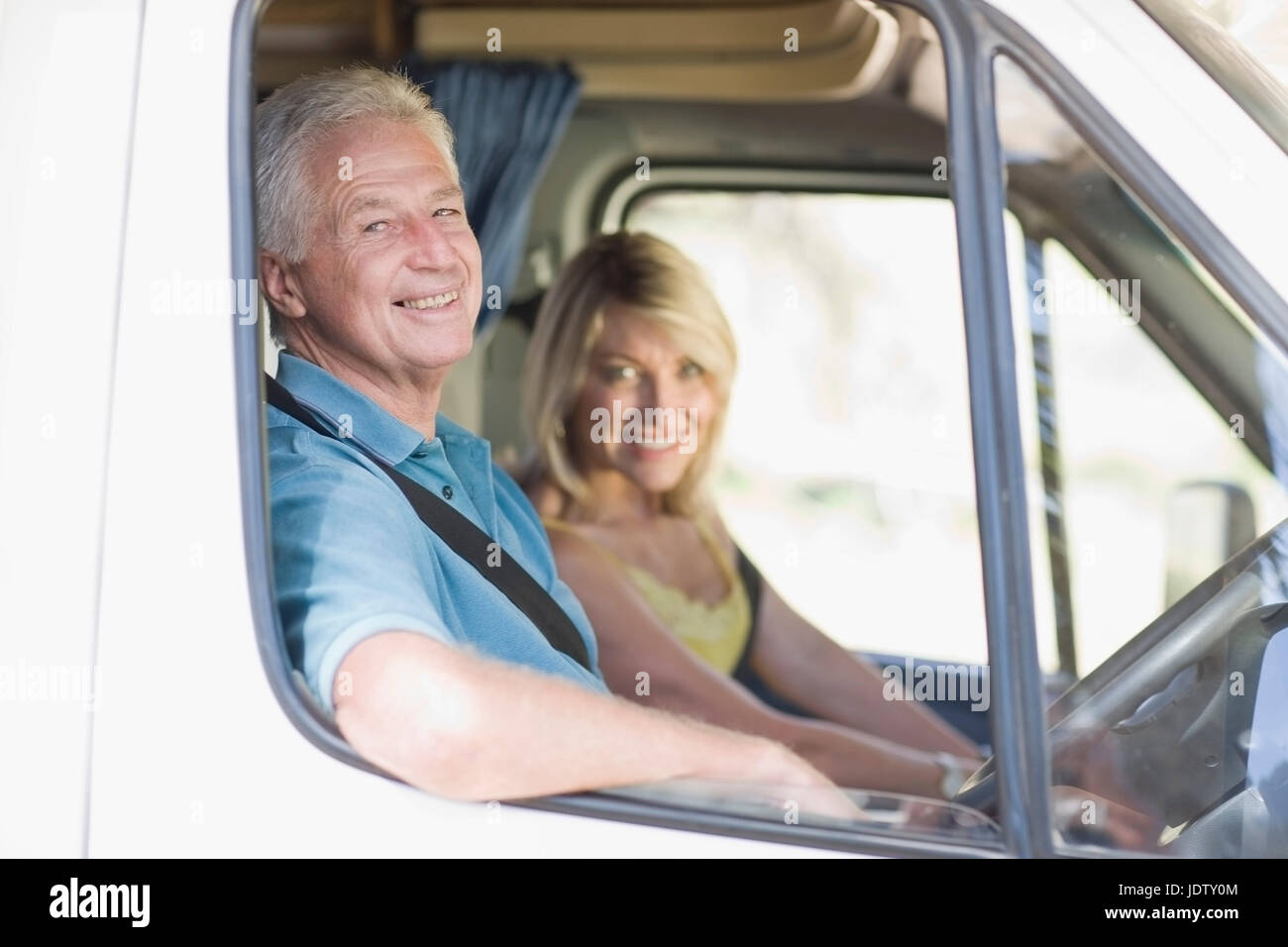 Mature woman driving recreational vehicle hi-res stock photography and ...