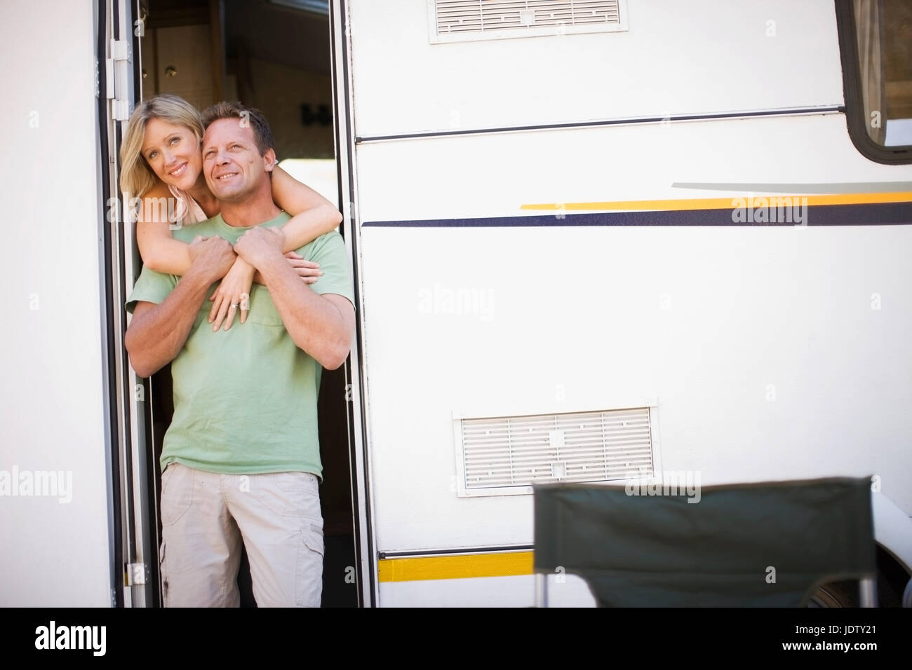Couple camping with RV Stock Photo - Alamy